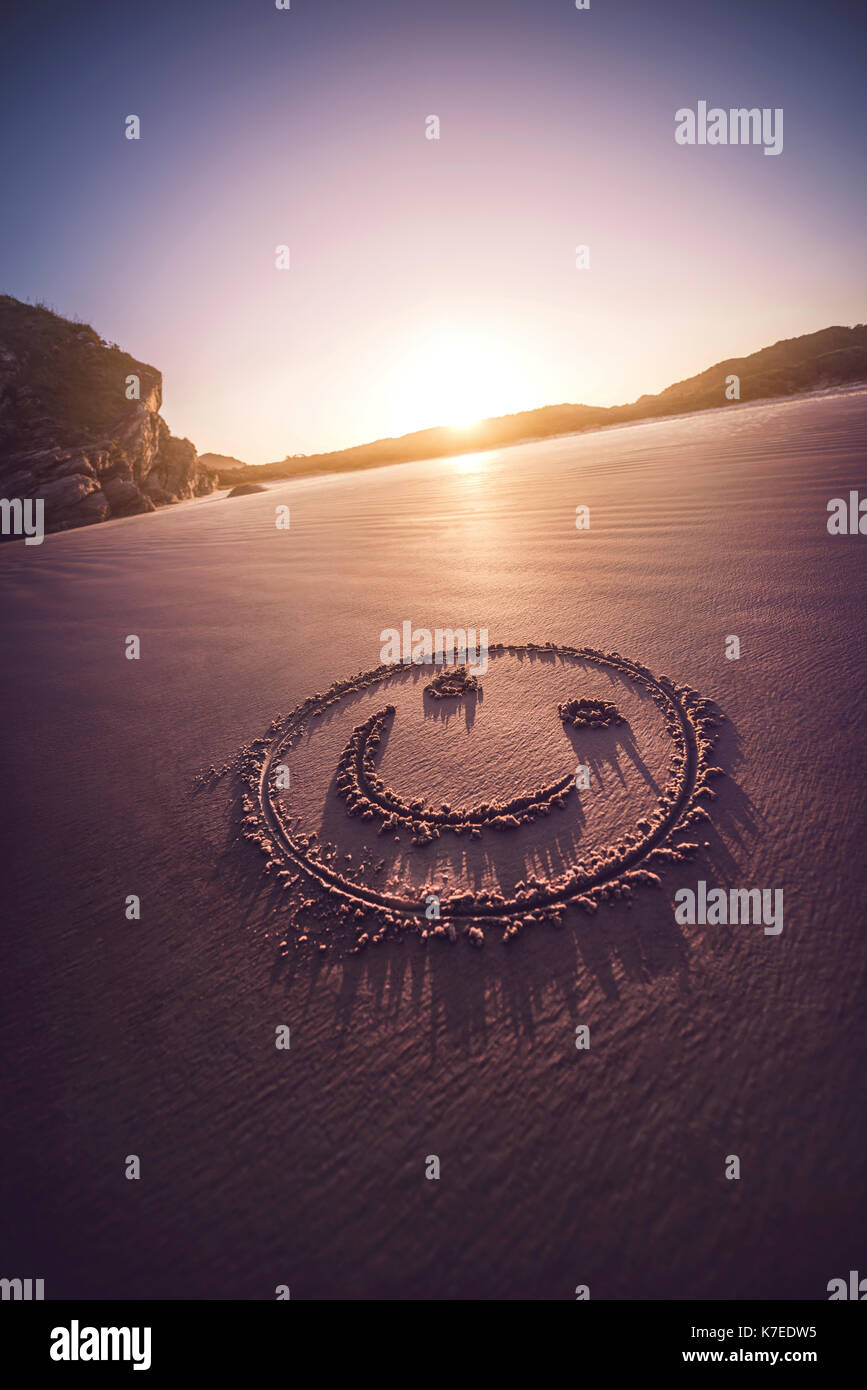 Face on beach Stock Photo - Alamy