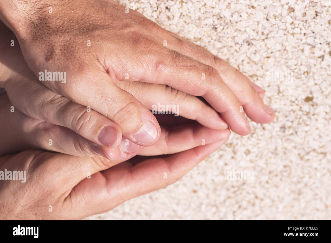 Intertwined hands young couple High Resolution Stock Photography and ...