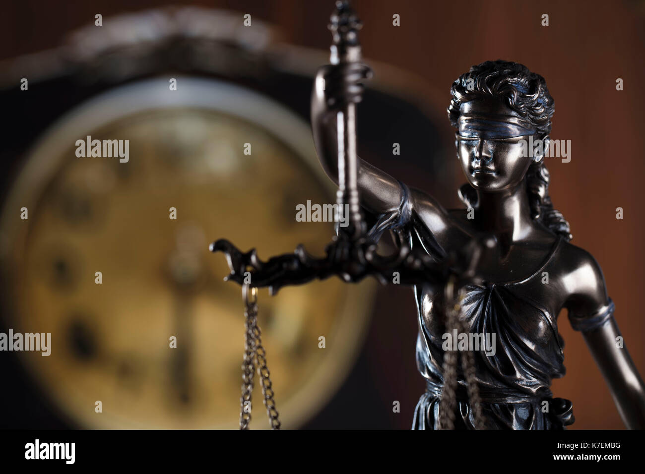 Old library. Vintage clock. Statue of justice and gavel. Law concept ...