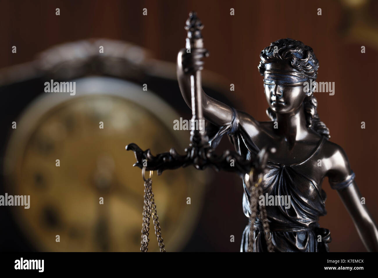 Old library. Vintage clock. Statue of justice and gavel. Law concept ...