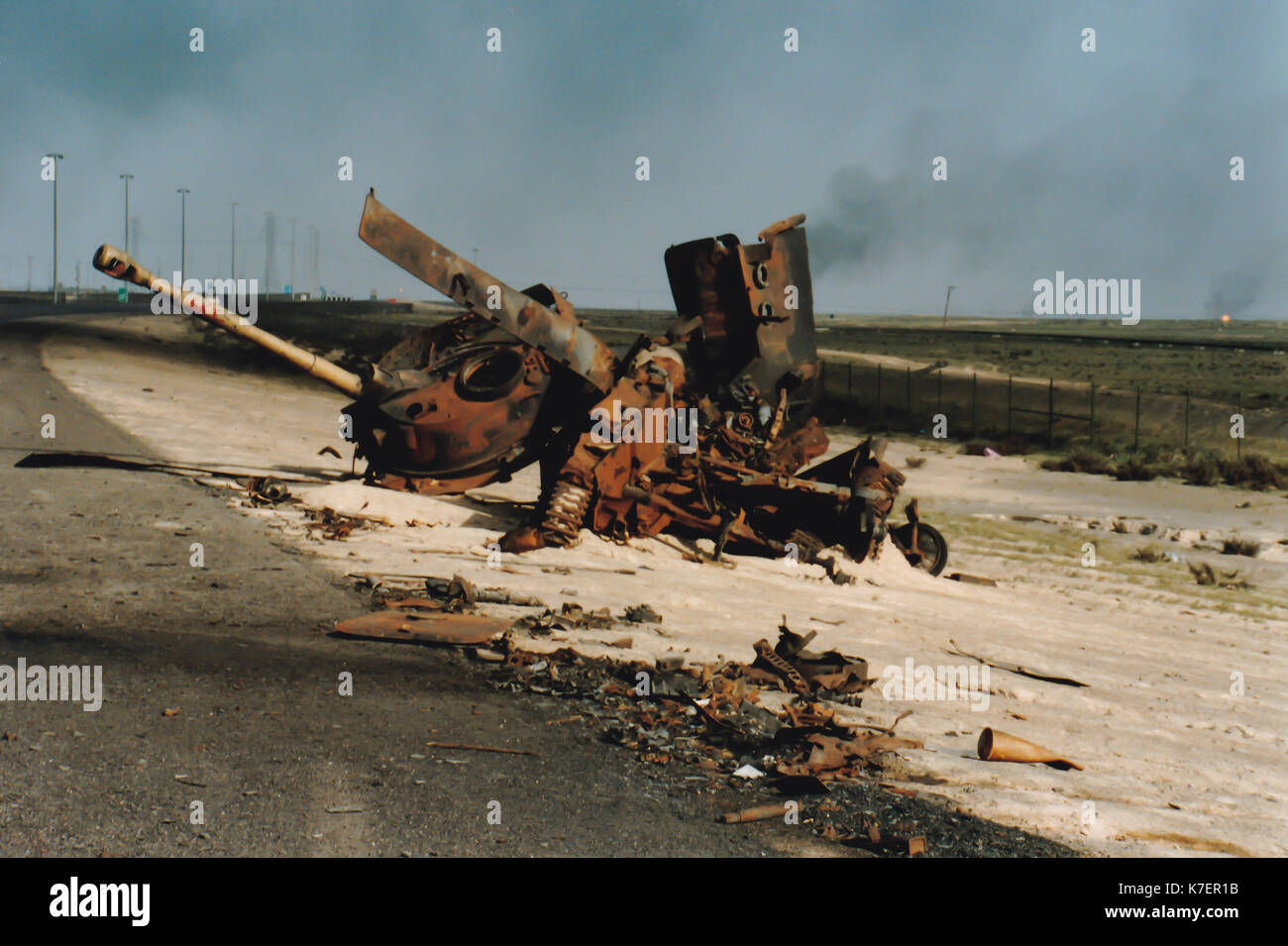 Burned bombed shell of Iraqi tank on side of roadway in Kuwait ...