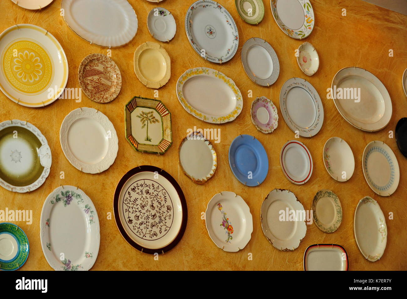 Plates on a wall of a Cuban restaurant Stock Photo - Alamy
