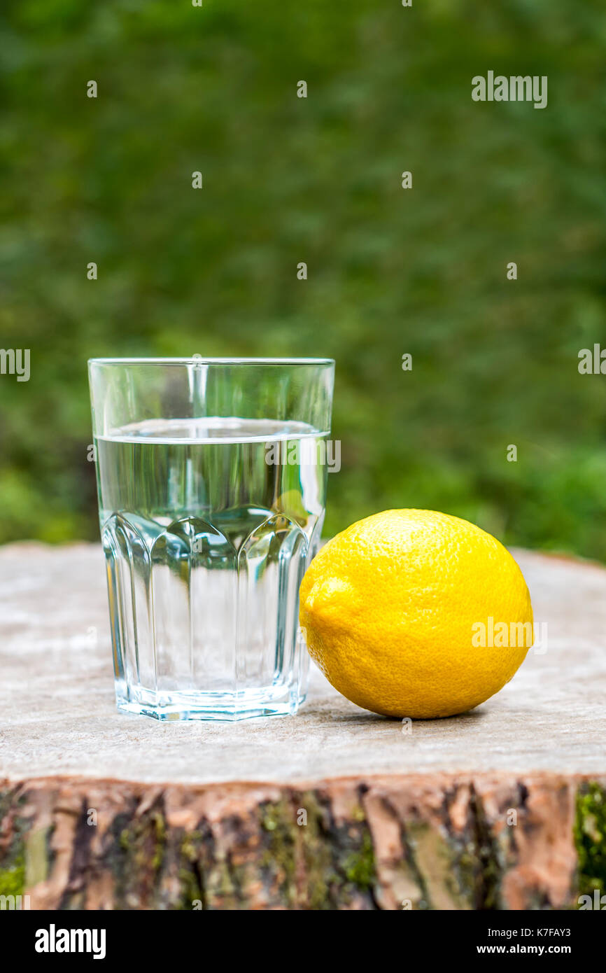 The lemon with a glass of water Stock Photo - Alamy