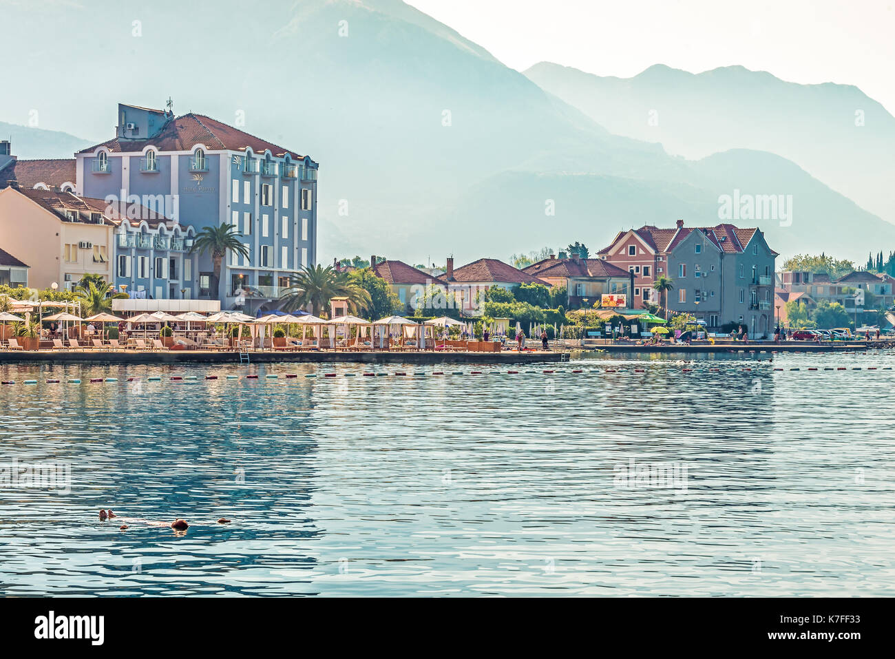 View of the beautiful beach in Tivat on the shore of Kotor Bay. Tivat ...