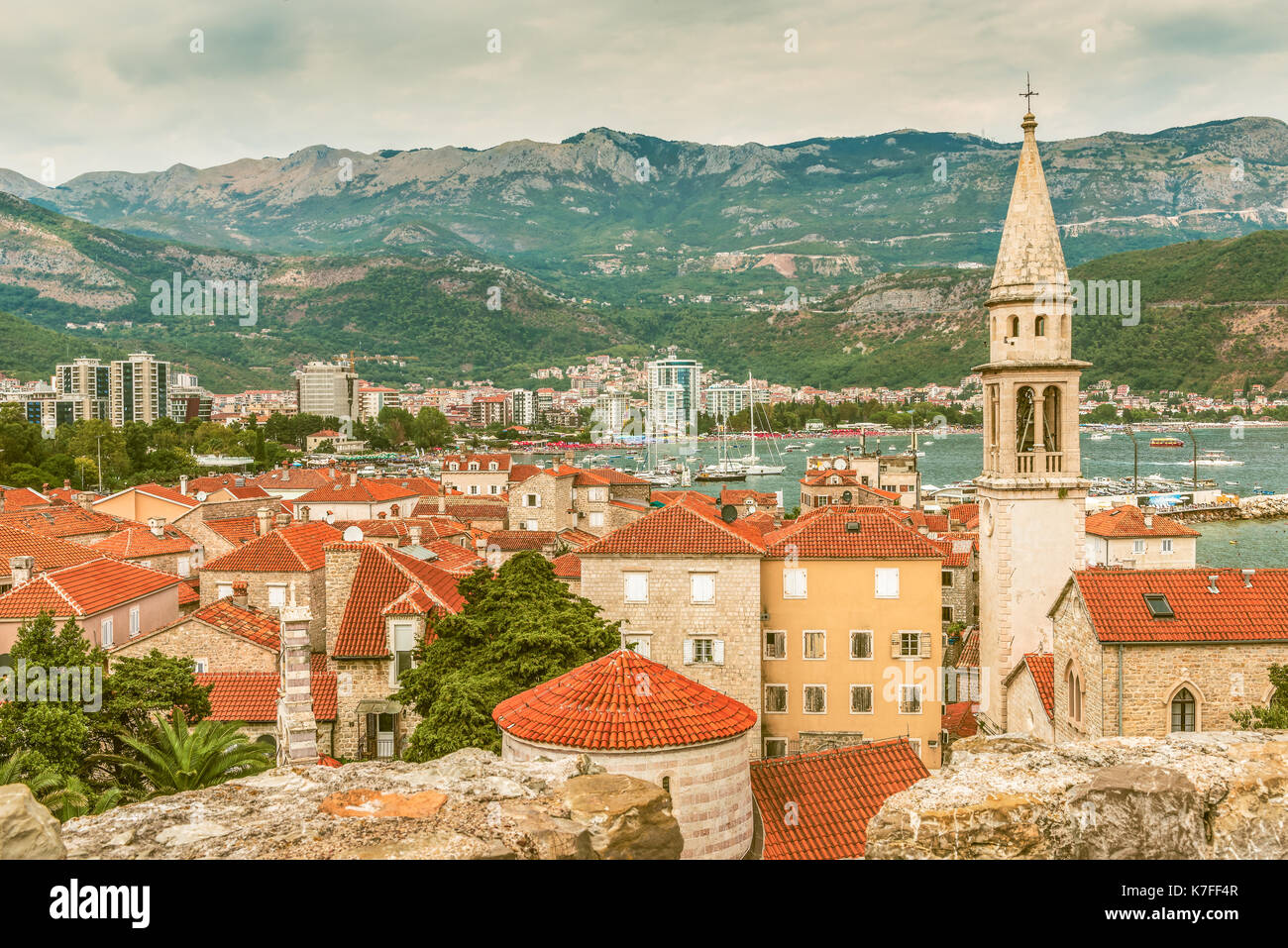 Landscape of Old town Budva: Ancient walls and red tiled roof ...