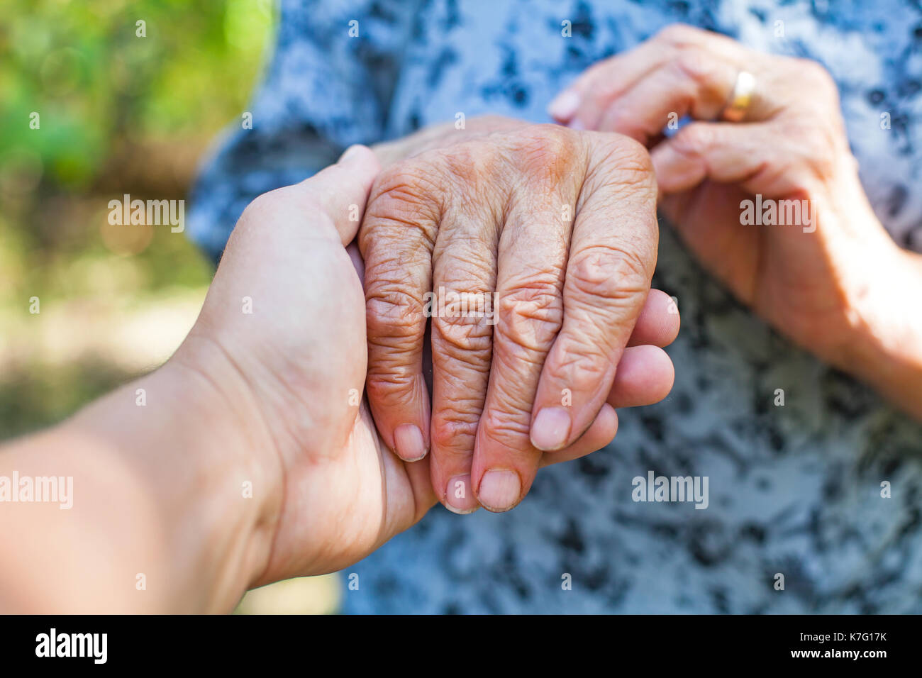 Carers hands hi-res stock photography and images - Alamy