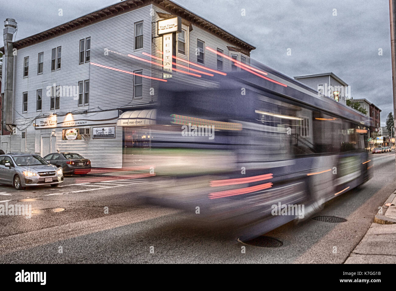 Traffic on Highland Street in Worcester, MA at night Stock Photo - Alamy
