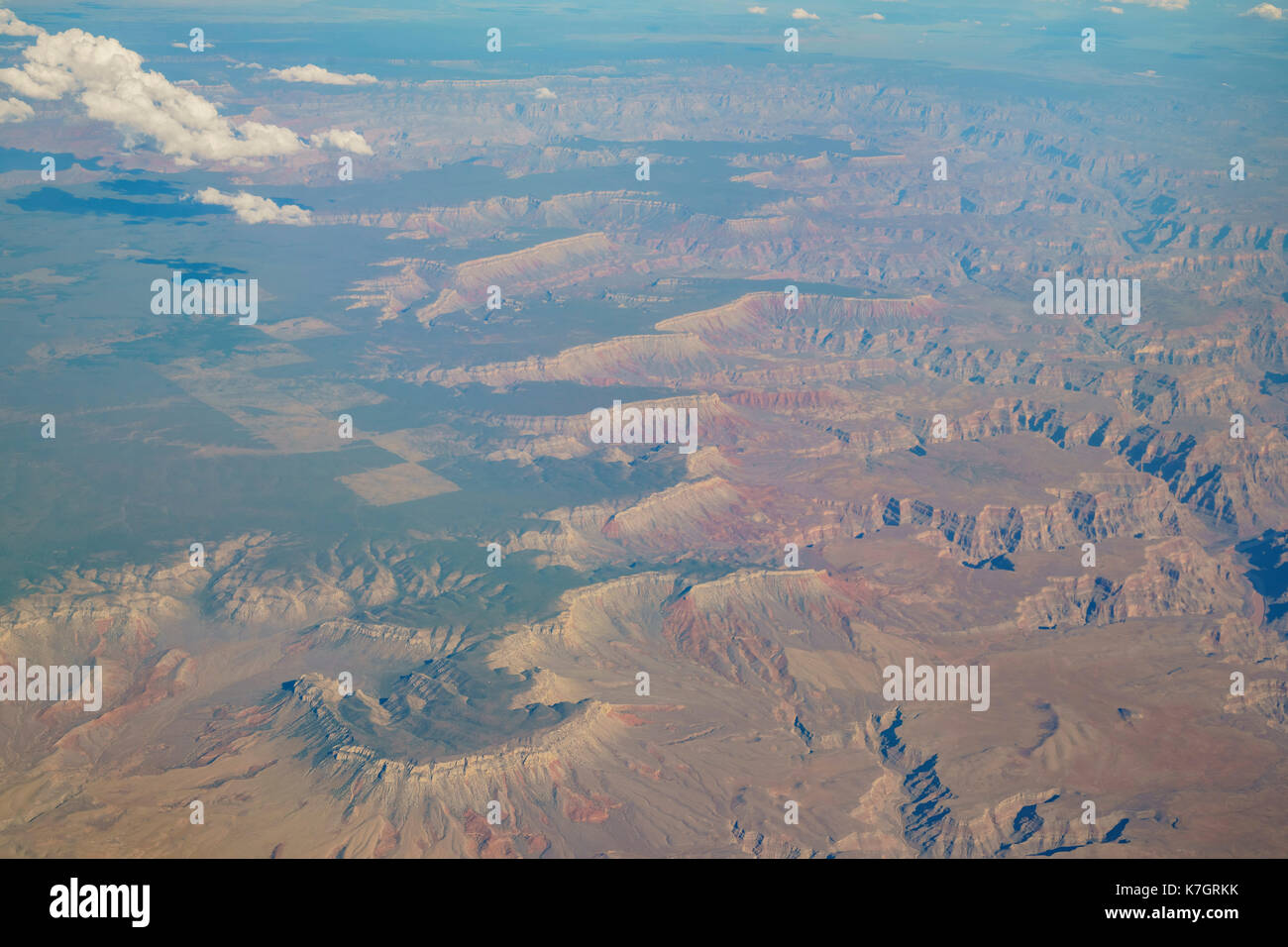Aerial view of mountain landscape, view from window seat in an airplane ...