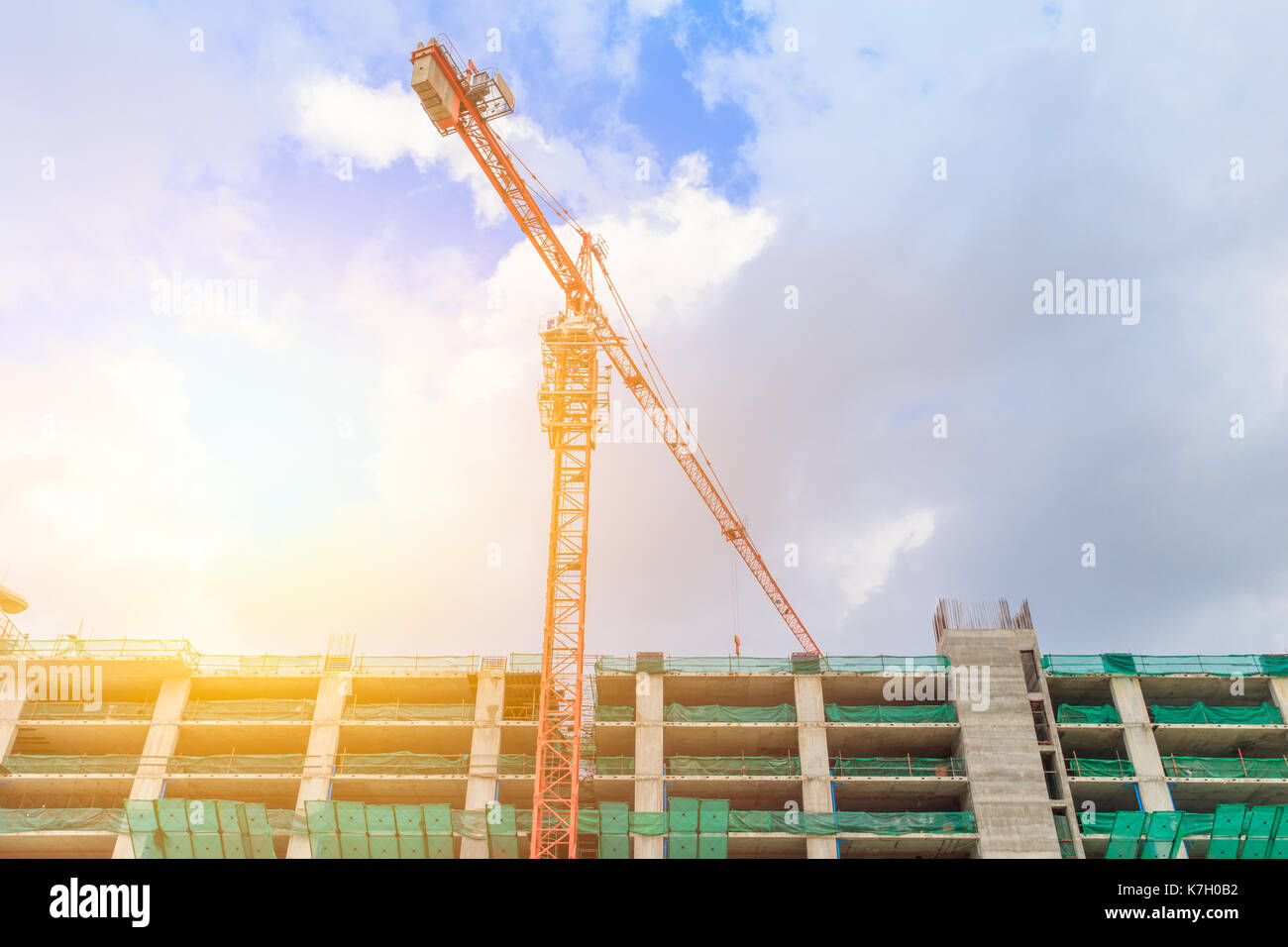 building with crane with morning sky sun light. construction future ...