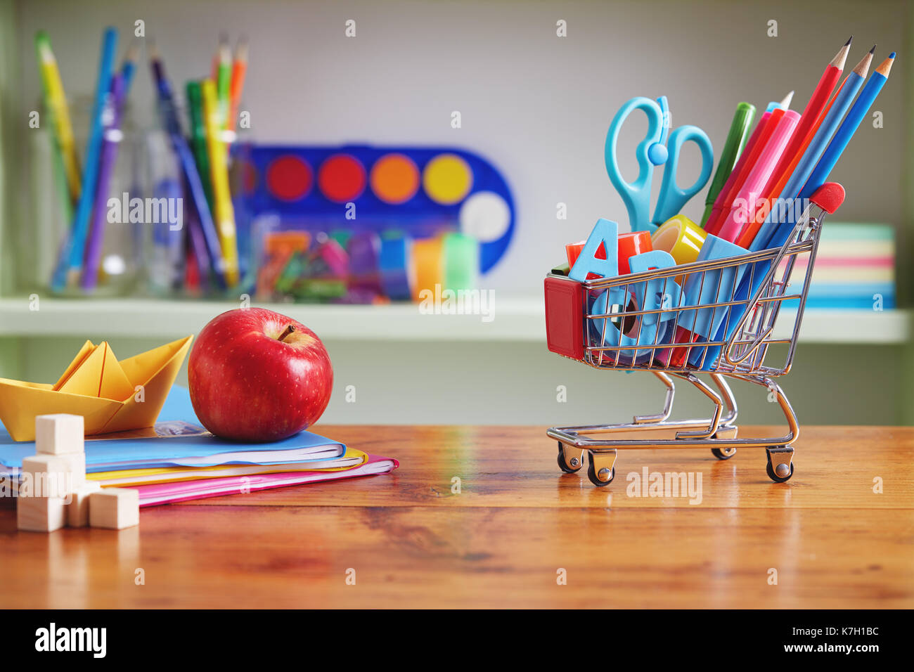 Back to School Shopping Cart with Supplies on Wooden Table. Shopping ...