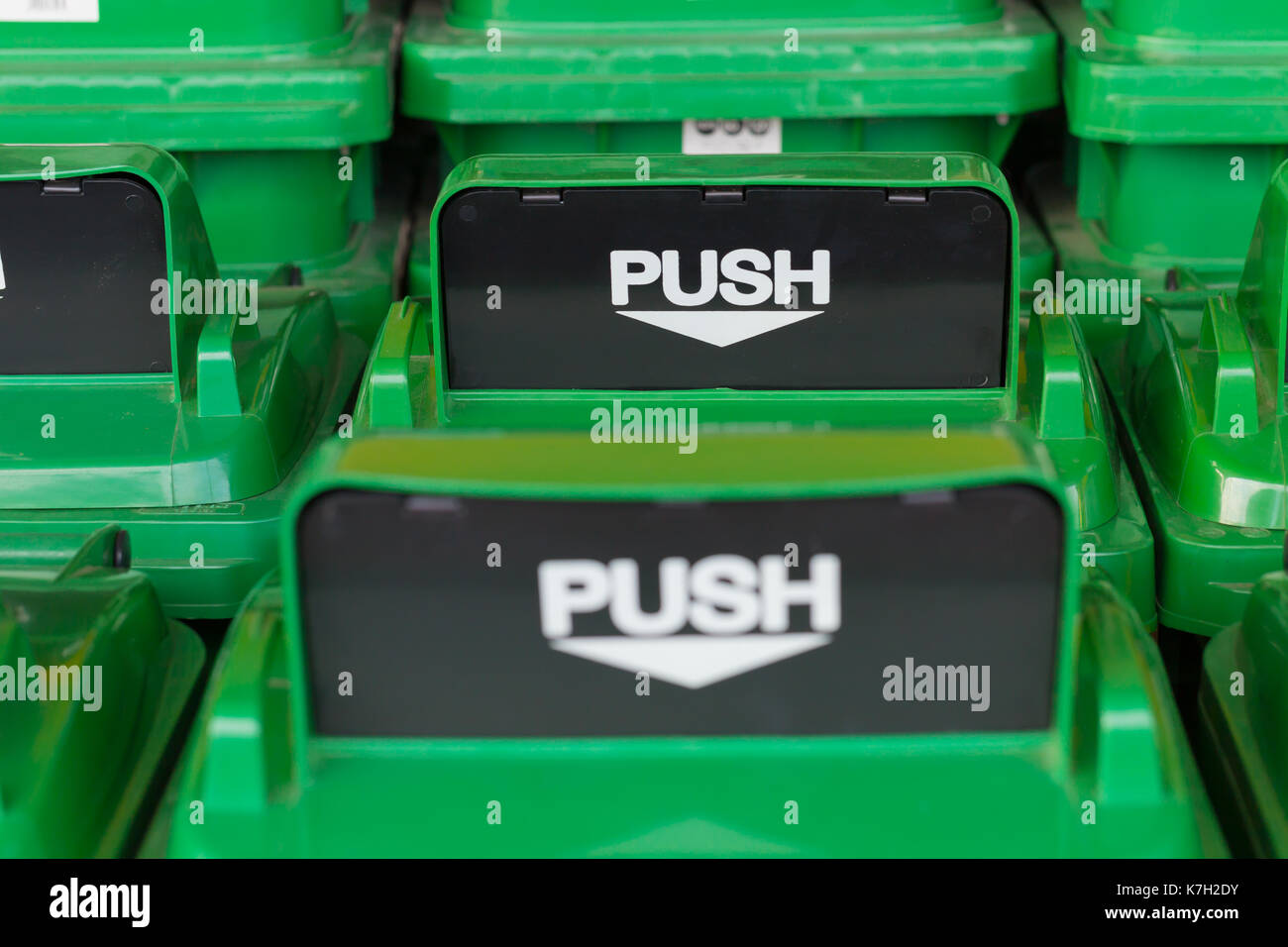 close up top green push hole or waste drop hole of trash bin or recycle ...