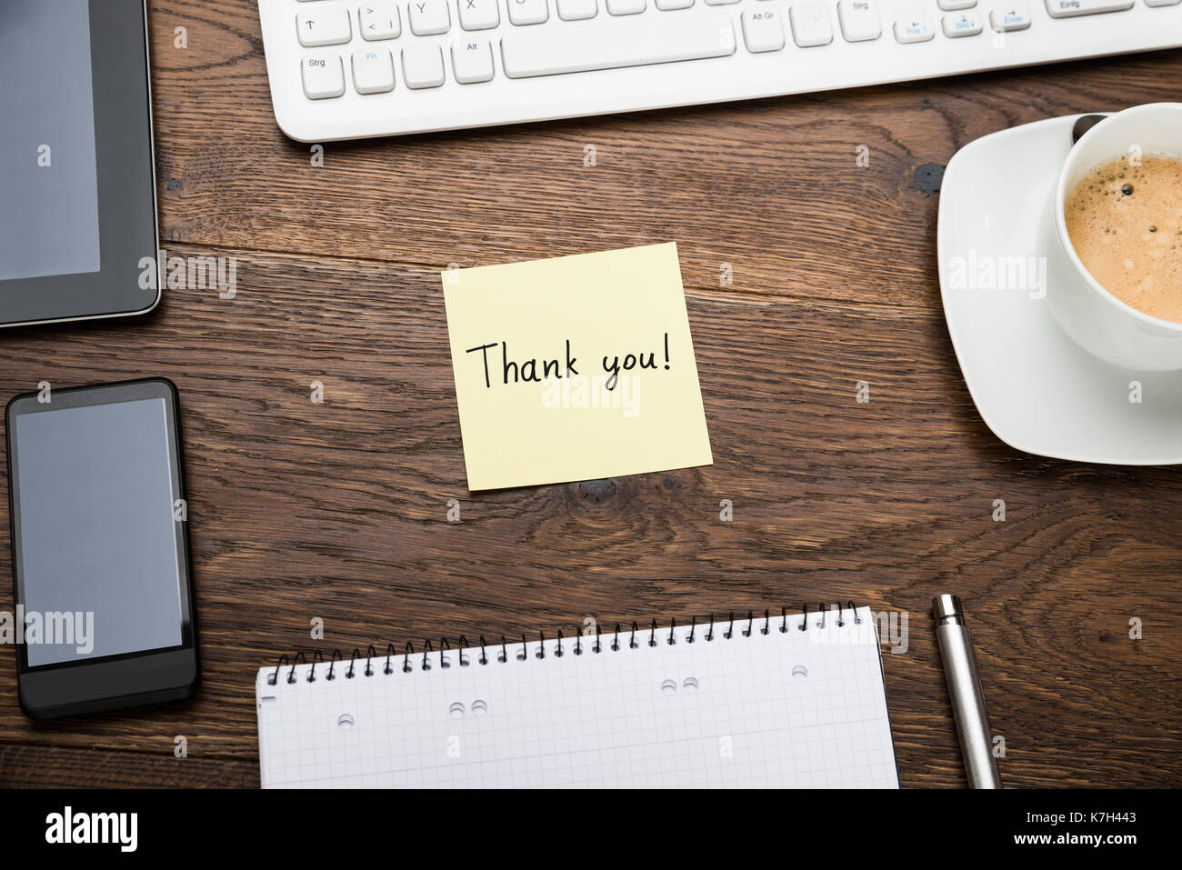 High Angle View Of Text Thank You On Post Note At Wooden Desk Stock ...
