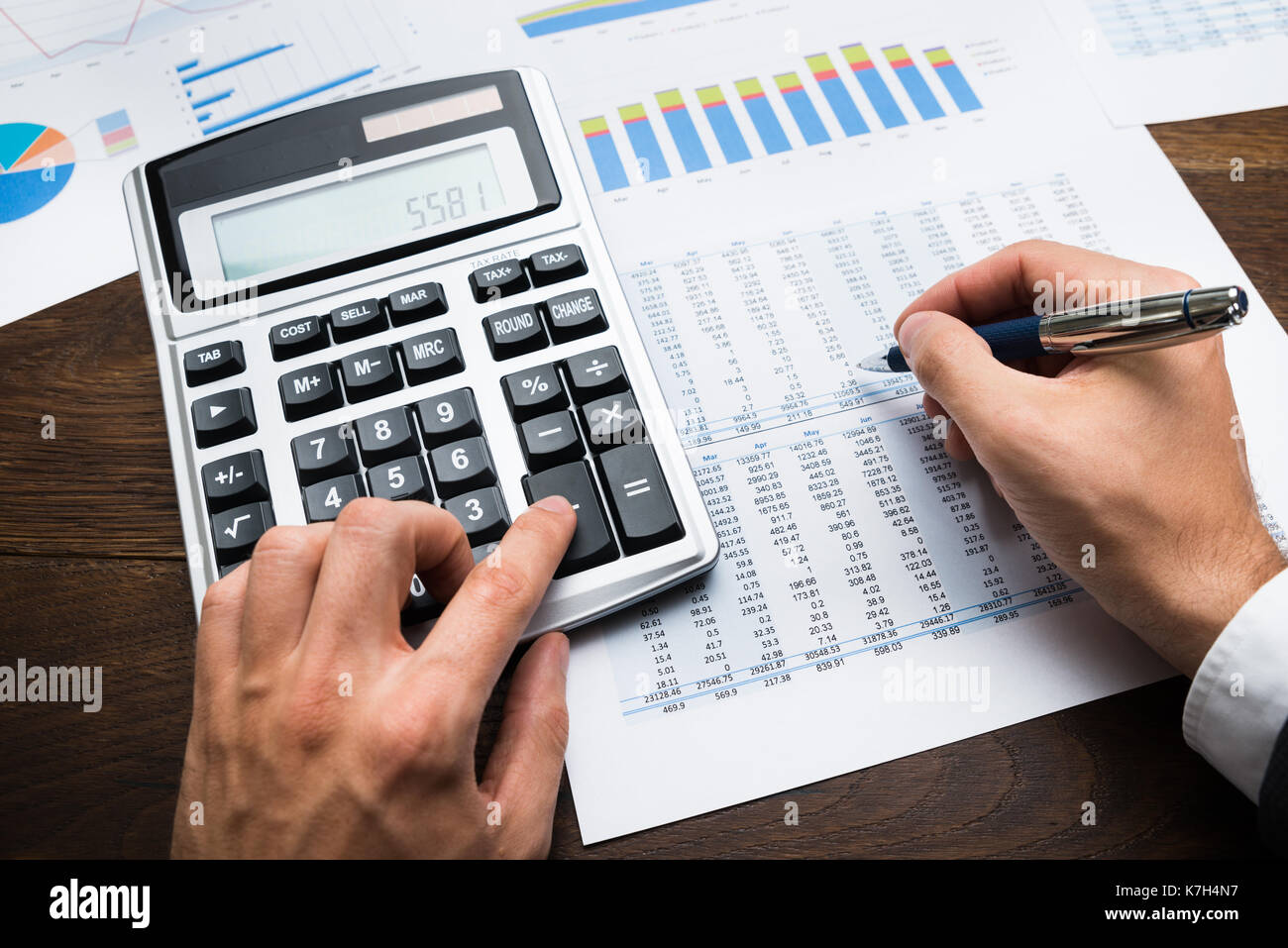 Businessman doing calculations hi-res stock photography and images - Alamy