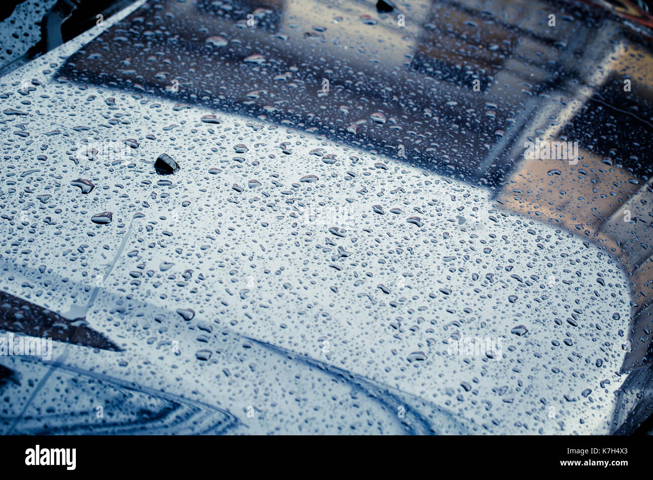 Car Hood with rain drop wet clean dark storm color tone in raining ...