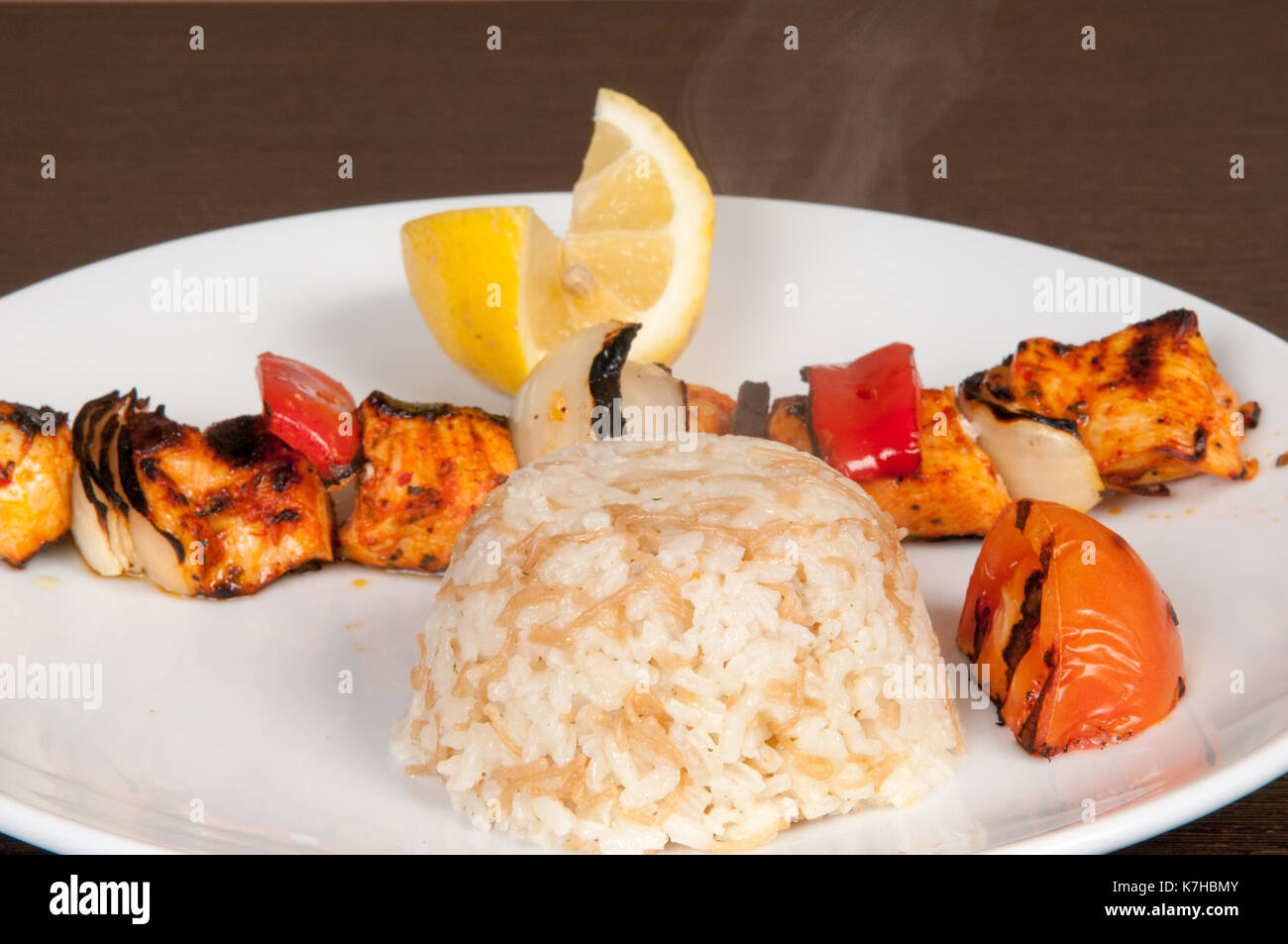 Grilled meat dish of shish kebab with onion Stock Photo - Alamy