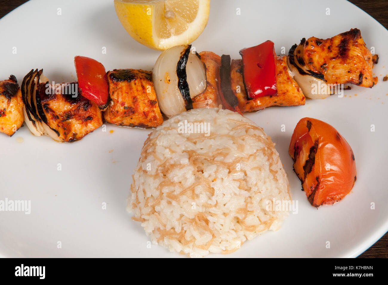 Grilled meat dish of shish kebab with onion Stock Photo - Alamy