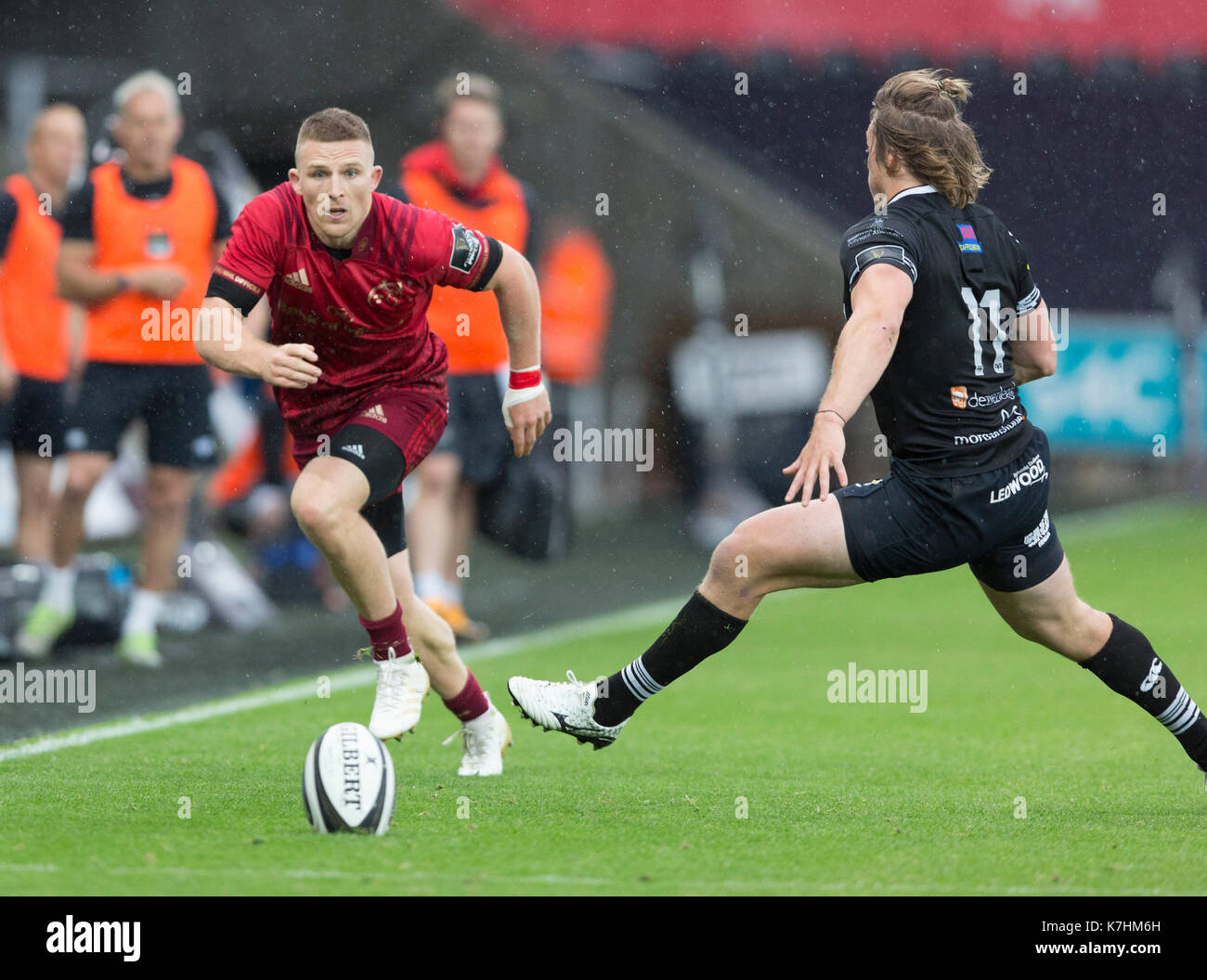 Munster's full back Andrew Conway (L) and Jeff Hassler (R) in action at ...