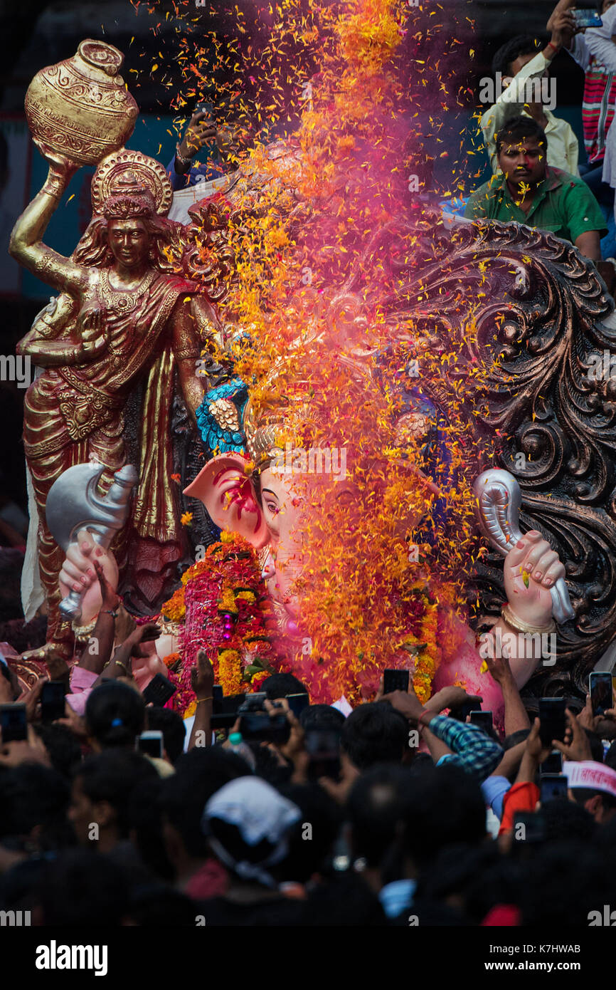 The image of Showering of flowers and colour powder on Ganpati or ...