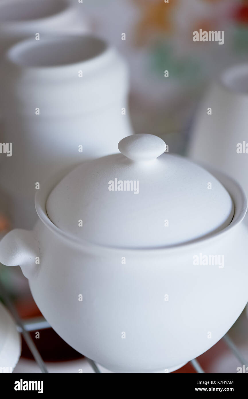 Set of white dishes isolated on white. Stack of plates Stock Photo - Alamy