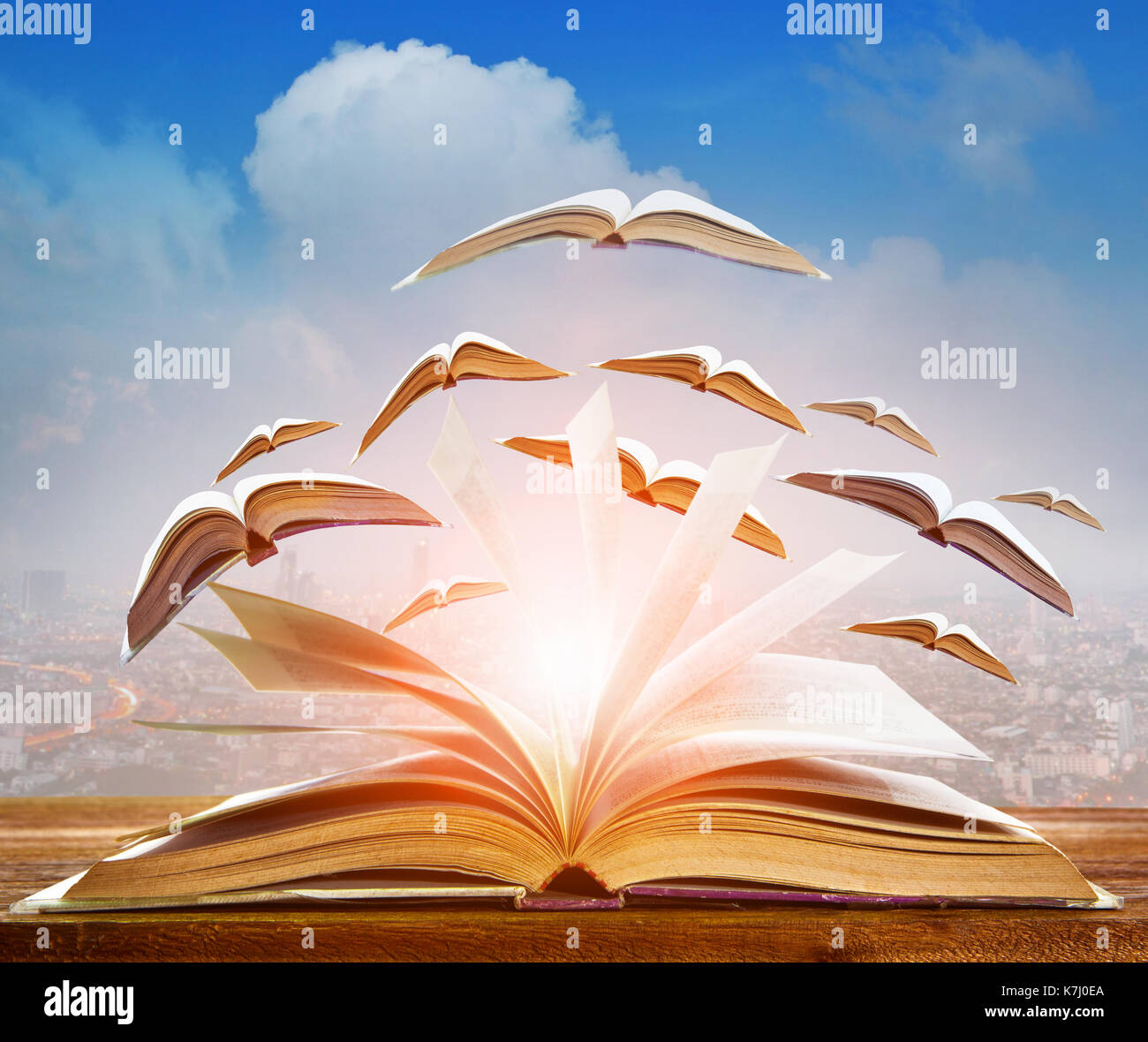 abstract of open book flying as knowledge wisdom going to future Stock ...