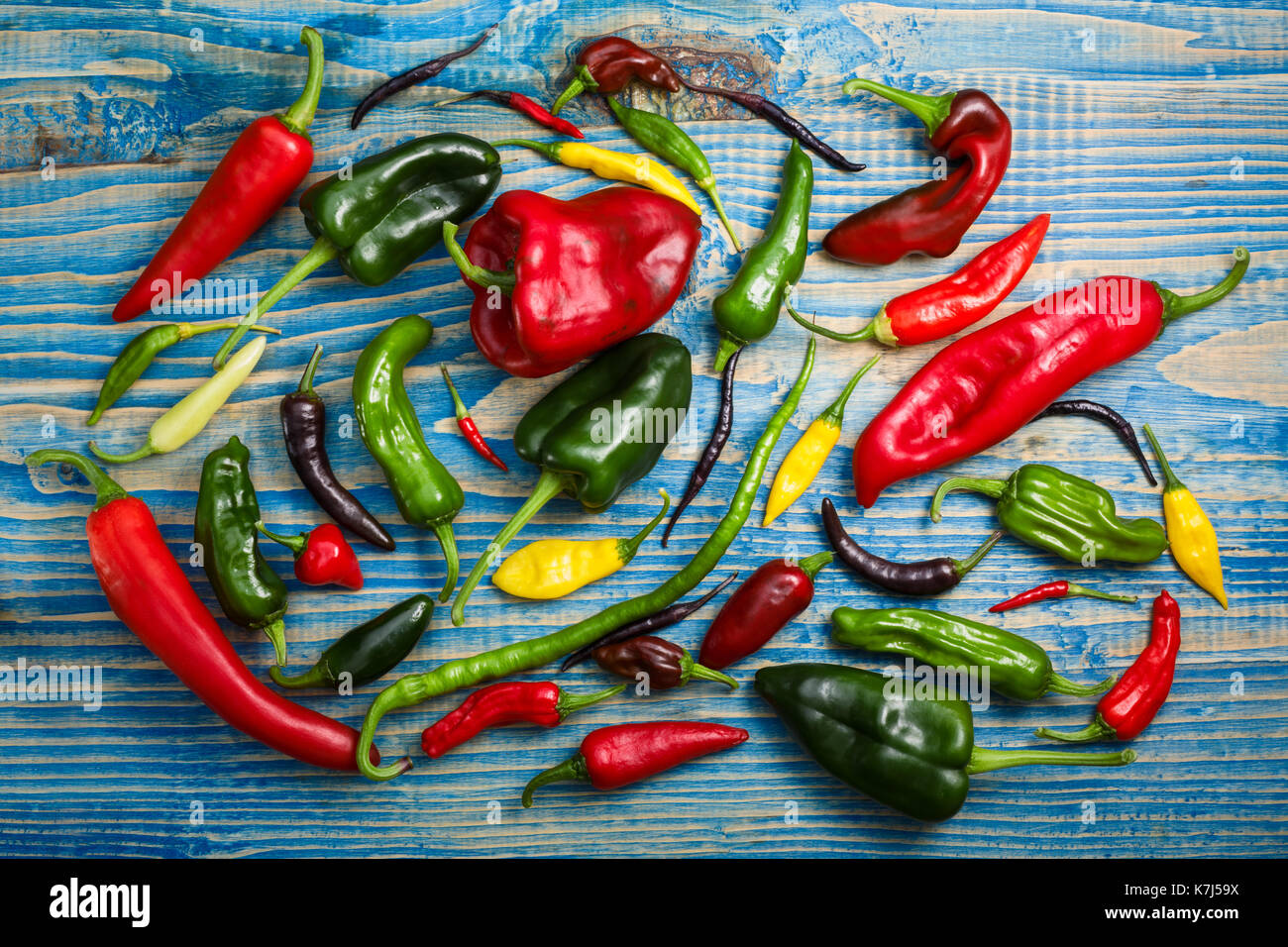 Colorful chile peppers mix. Different shapes and colors, top view Stock ...