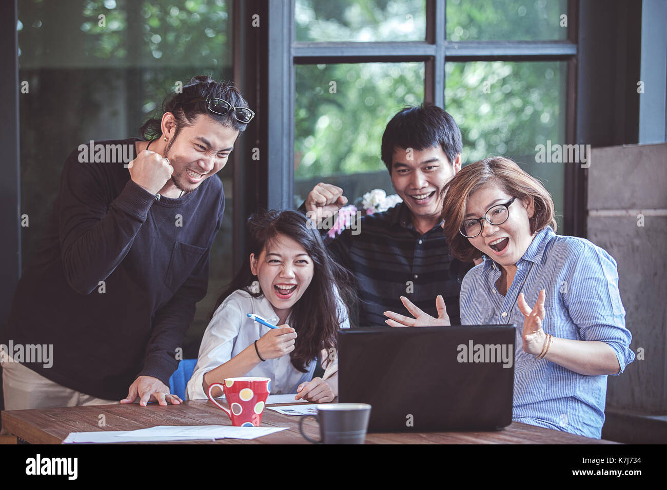 asian freelance teamwork happiness emotion looking to laptop computer in home office Stock Photo ...