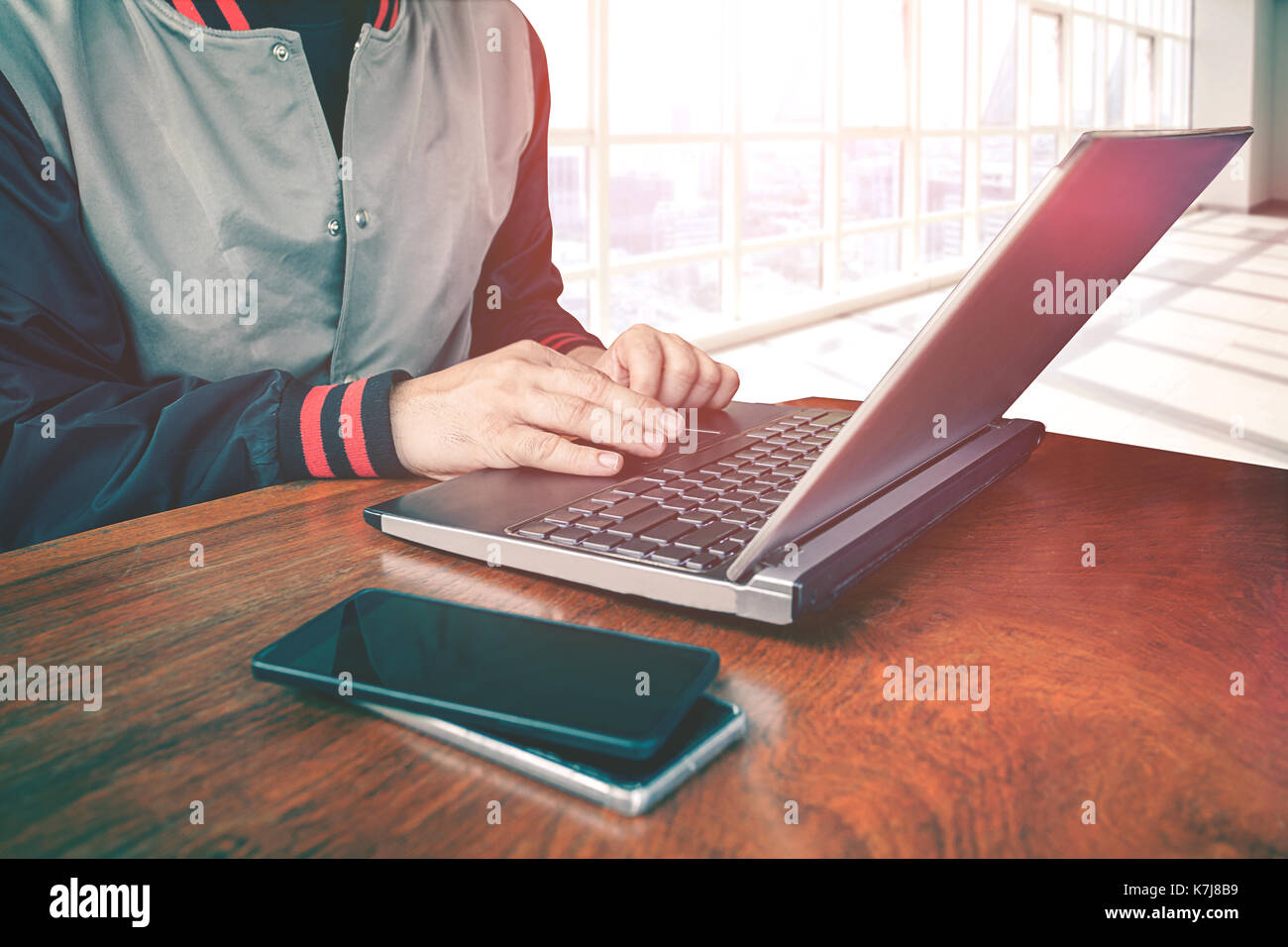 freelance man working with laptop computer connecting to internet ...