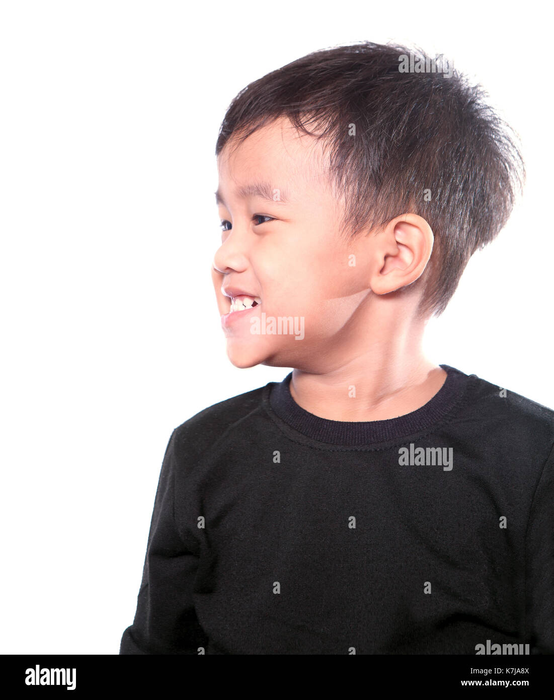 close up side head shot of asian children toothy smiling face isolated ...