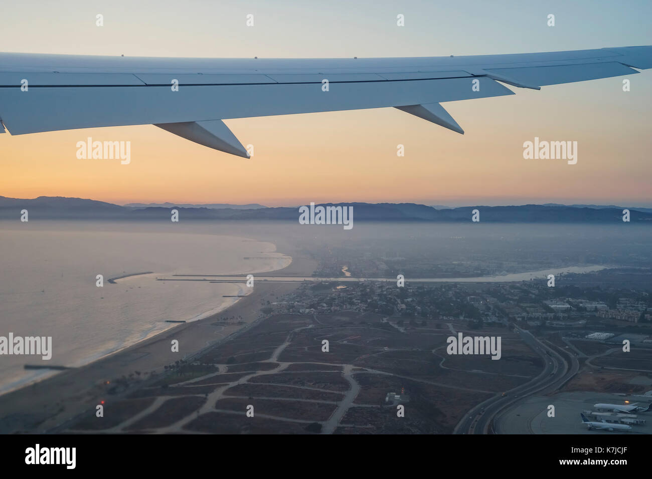 Sunset aerial Marina Del Rey Jetty and cityscape view of sky from a ...