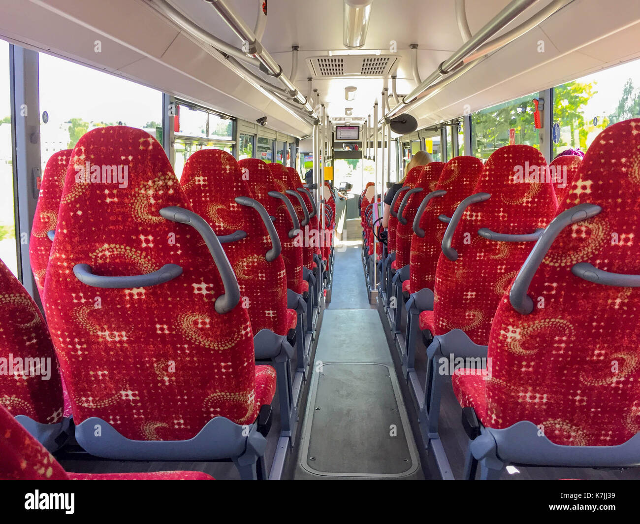 Empty public bus with red seats, Luxembourg Stock Photo - Alamy