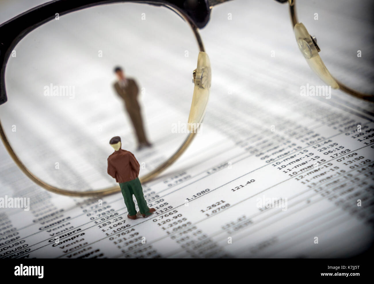 Figures of men separated by glasses, concept of economy Stock Photo - Alamy