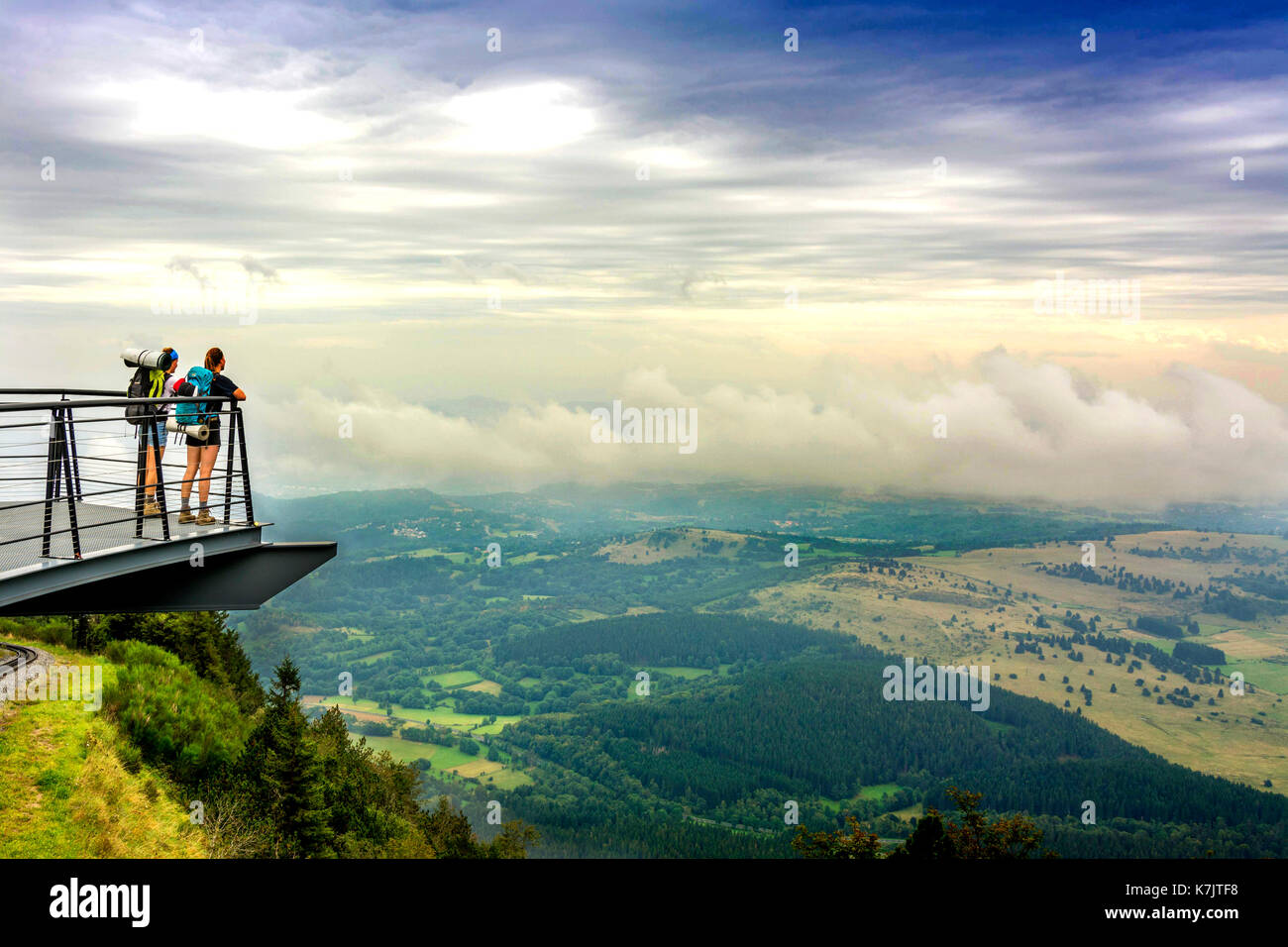 Walkers on a viewing platform facing the Limagne plain from Volcano of ...