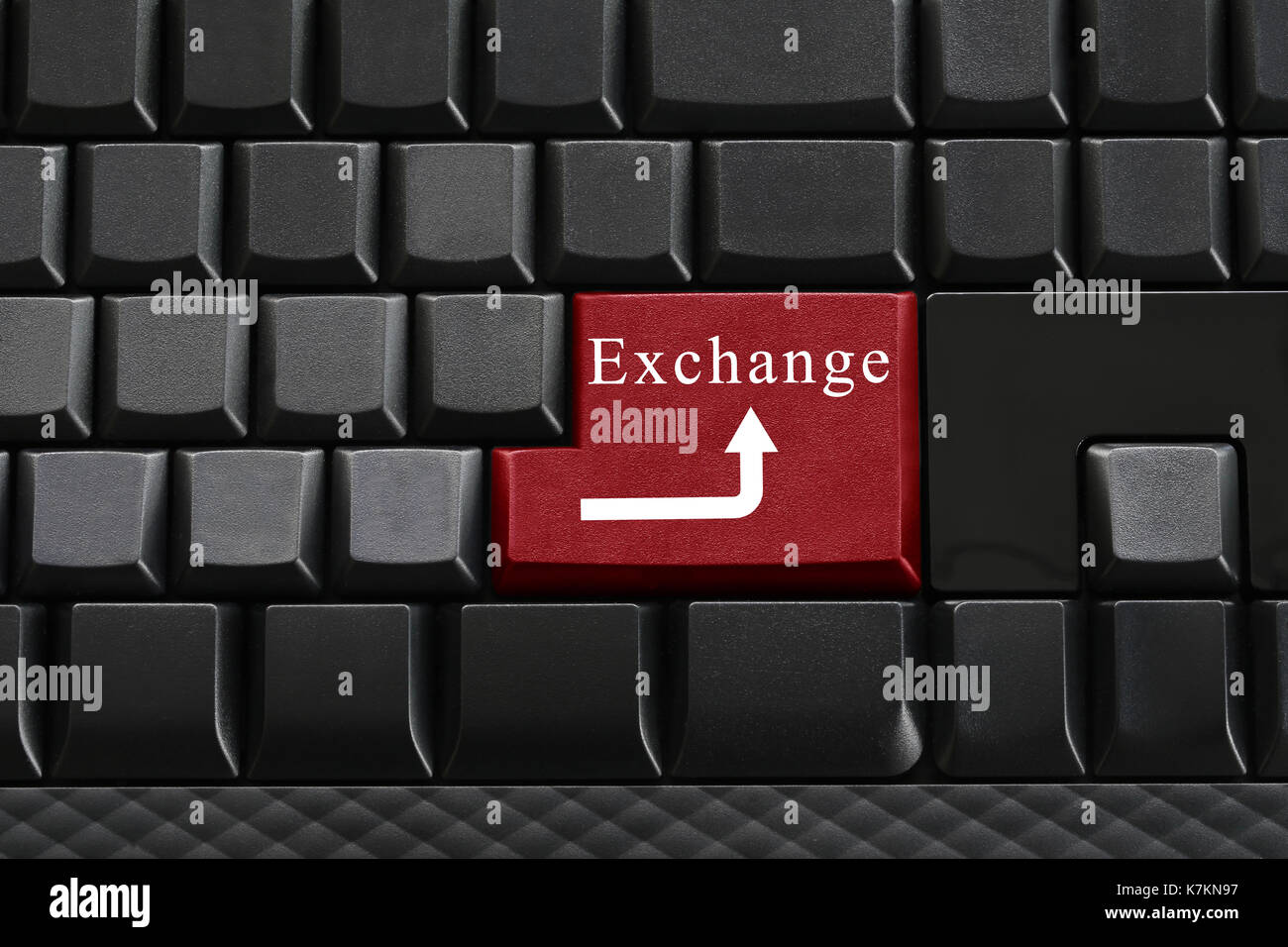Keypad of black keyboard and have text Exchange on enter button for ...