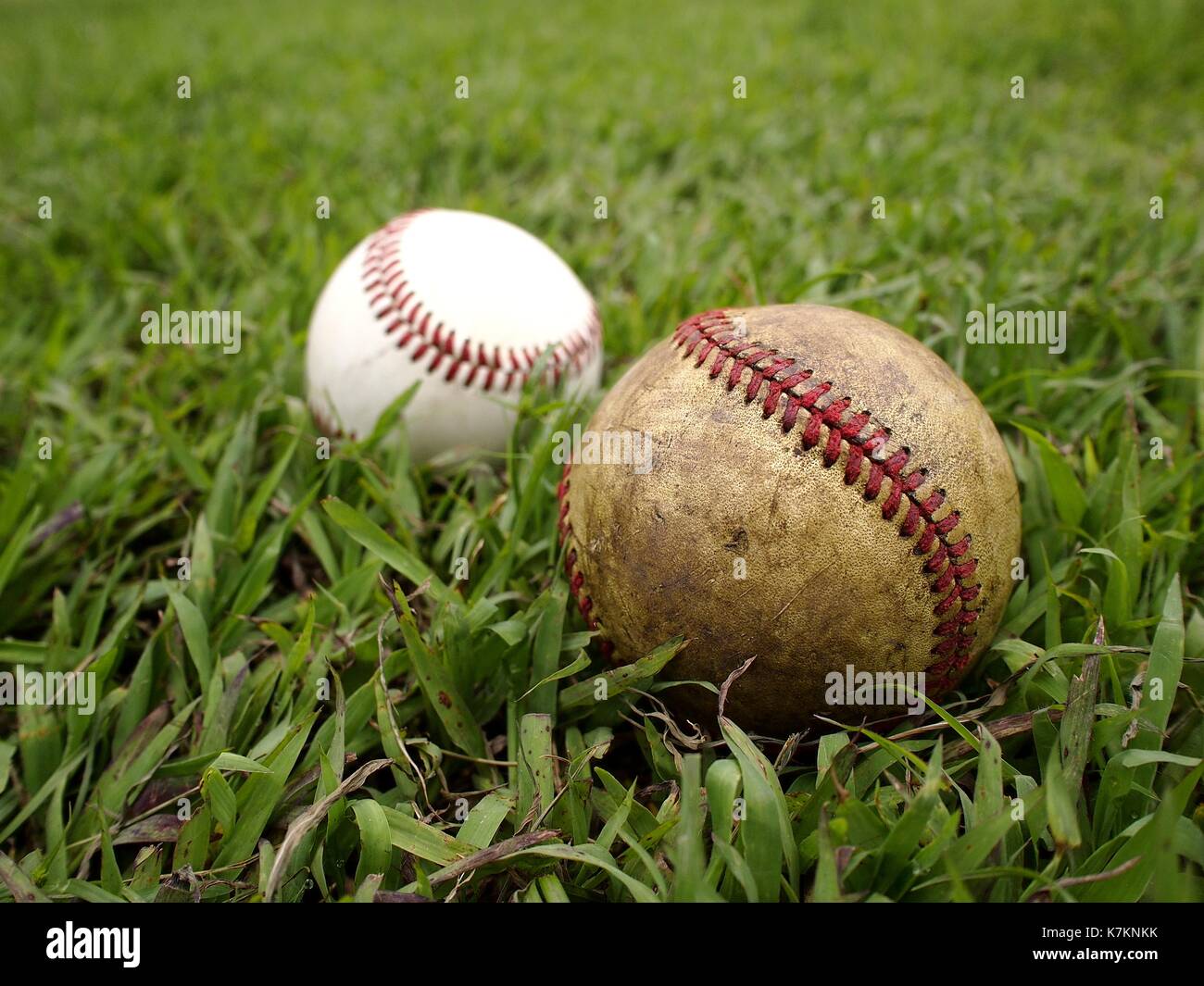 Photo of a baseball on a field of grass Stock Photo - Alamy