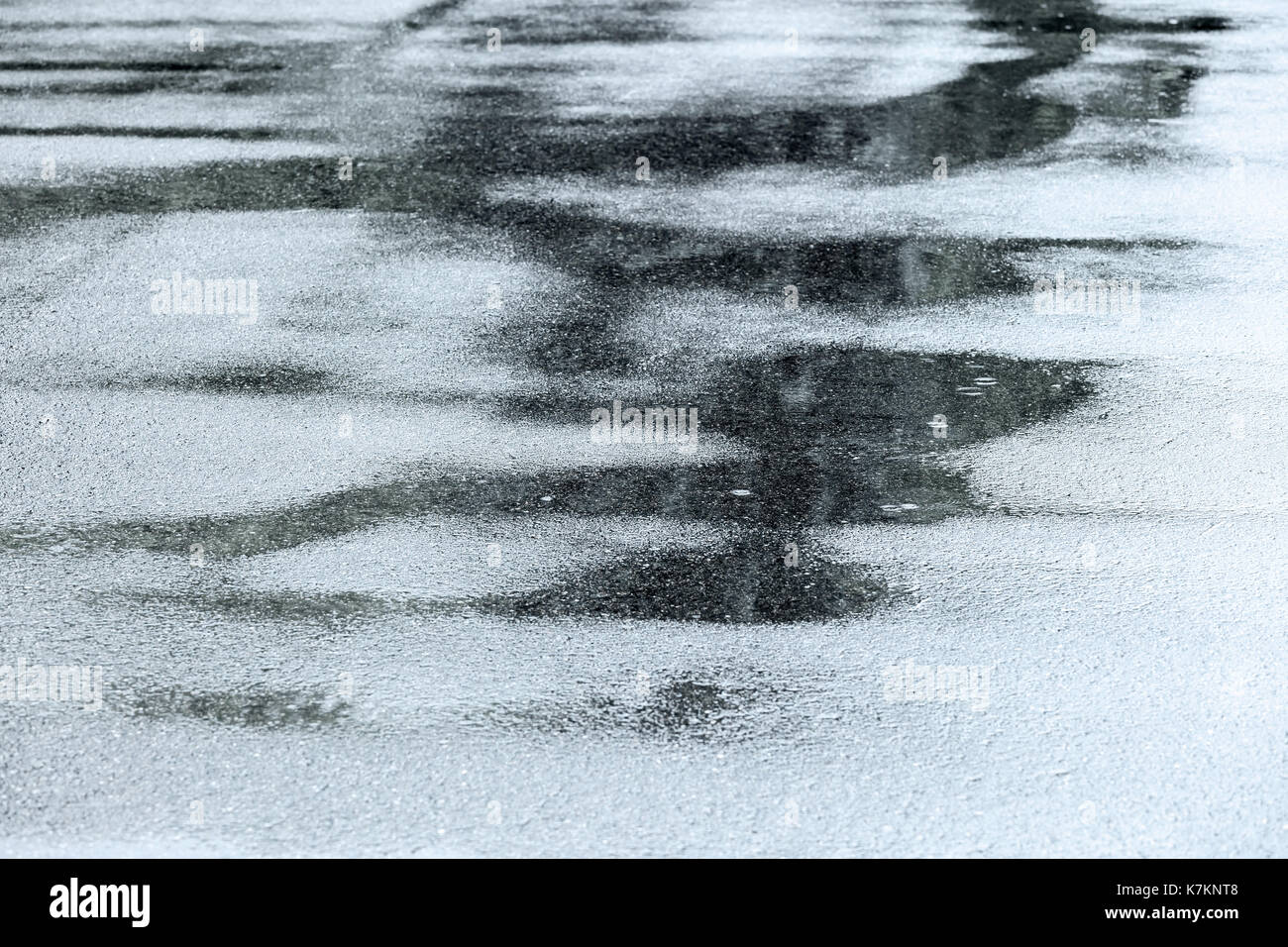 wet asphalt pavement with puddles and raindrops after heavy rain Stock ...