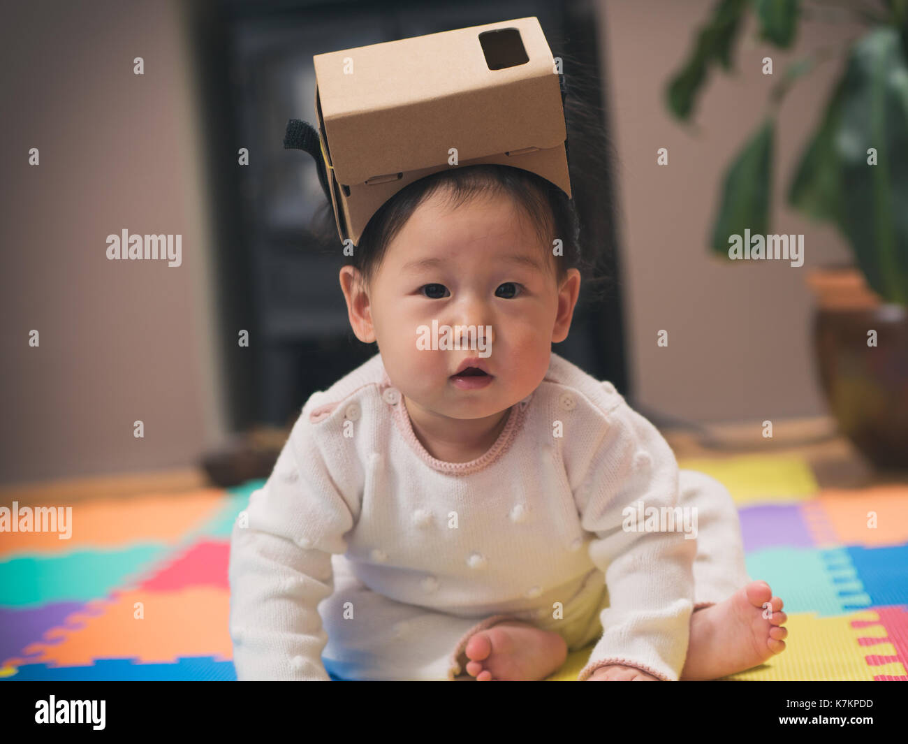 baby girl playing DIY virtual reality simulator Stock Photo - Alamy