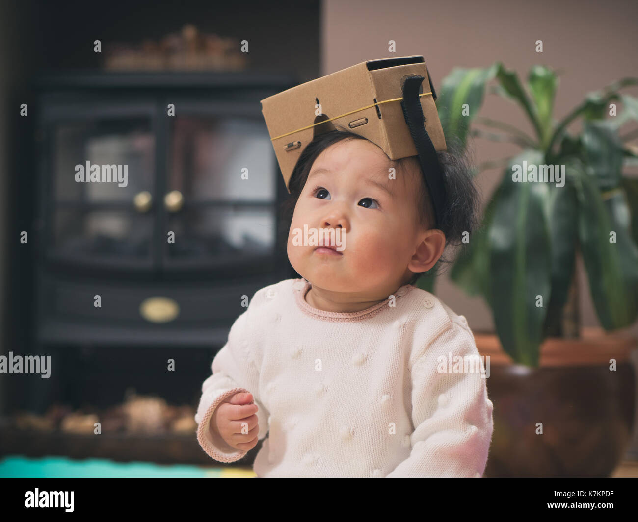 baby girl playing DIY virtual reality simulator Stock Photo - Alamy
