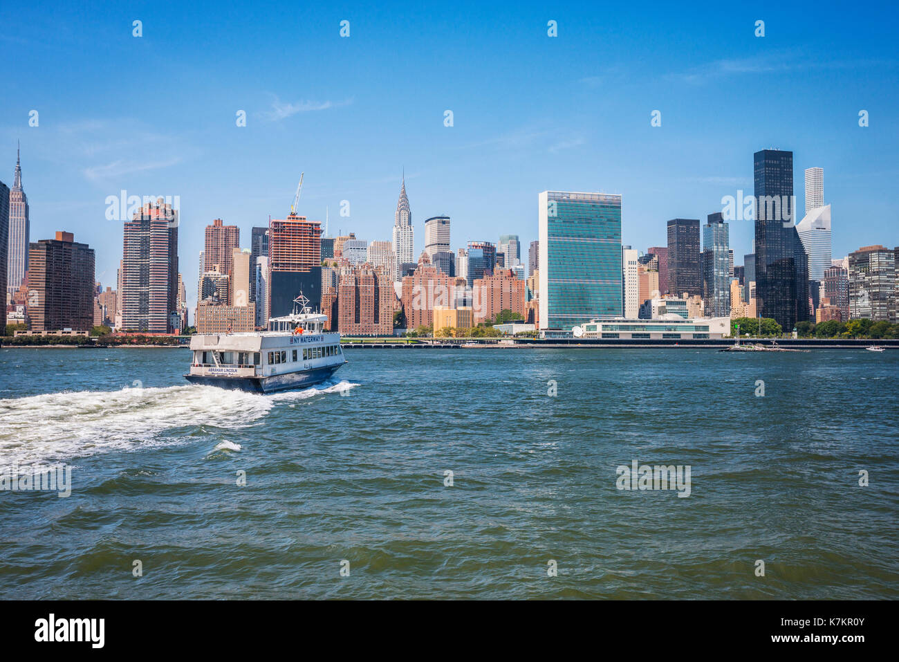 Skyline New York City with ferry boat in front Stock Photo - Alamy