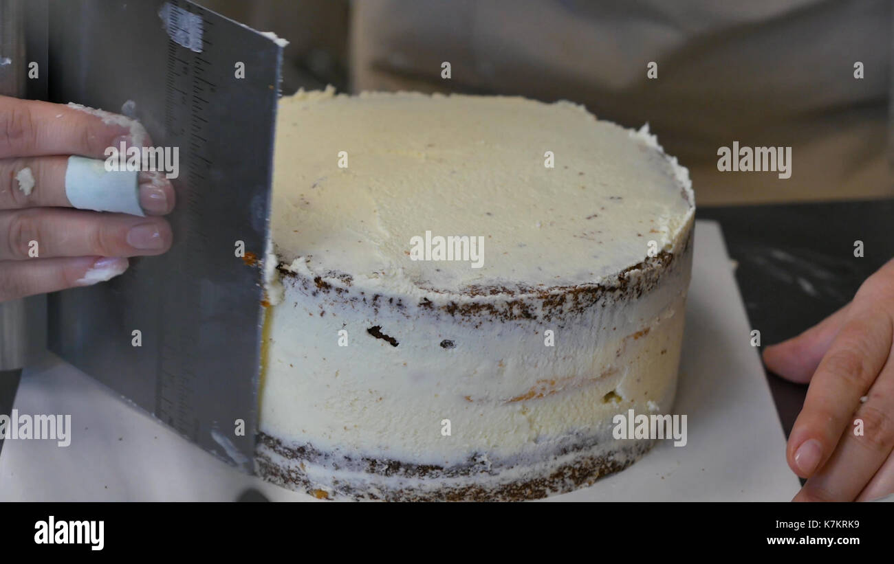 A cake from several layers. The end of the cooking, layered cake Stock ...