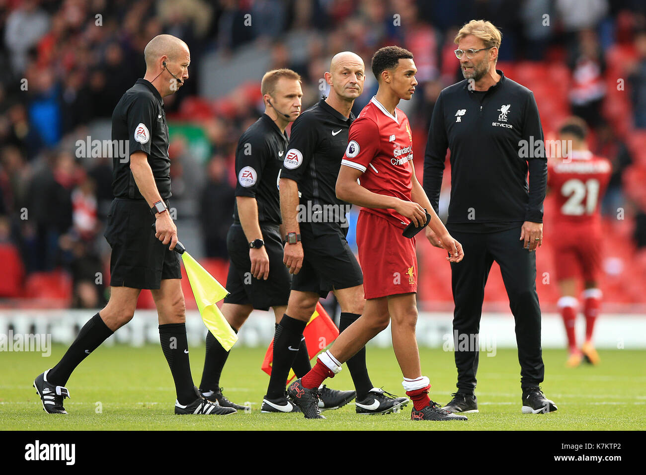 Liverpool manager Jurgen Klopp (right) tries to speak to referee Roger ...