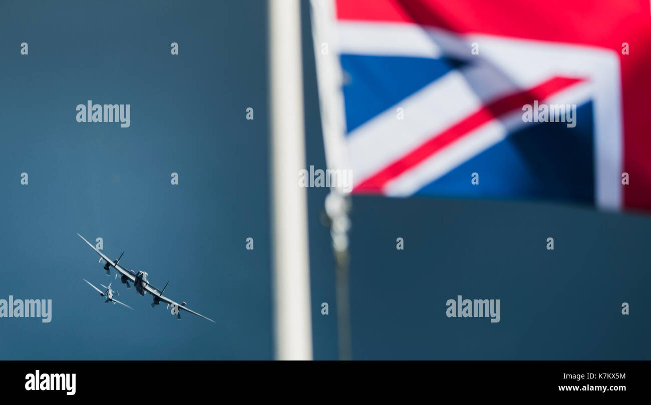 A Lancaster bomber and a Spitfire flypast during the Preston Military ...