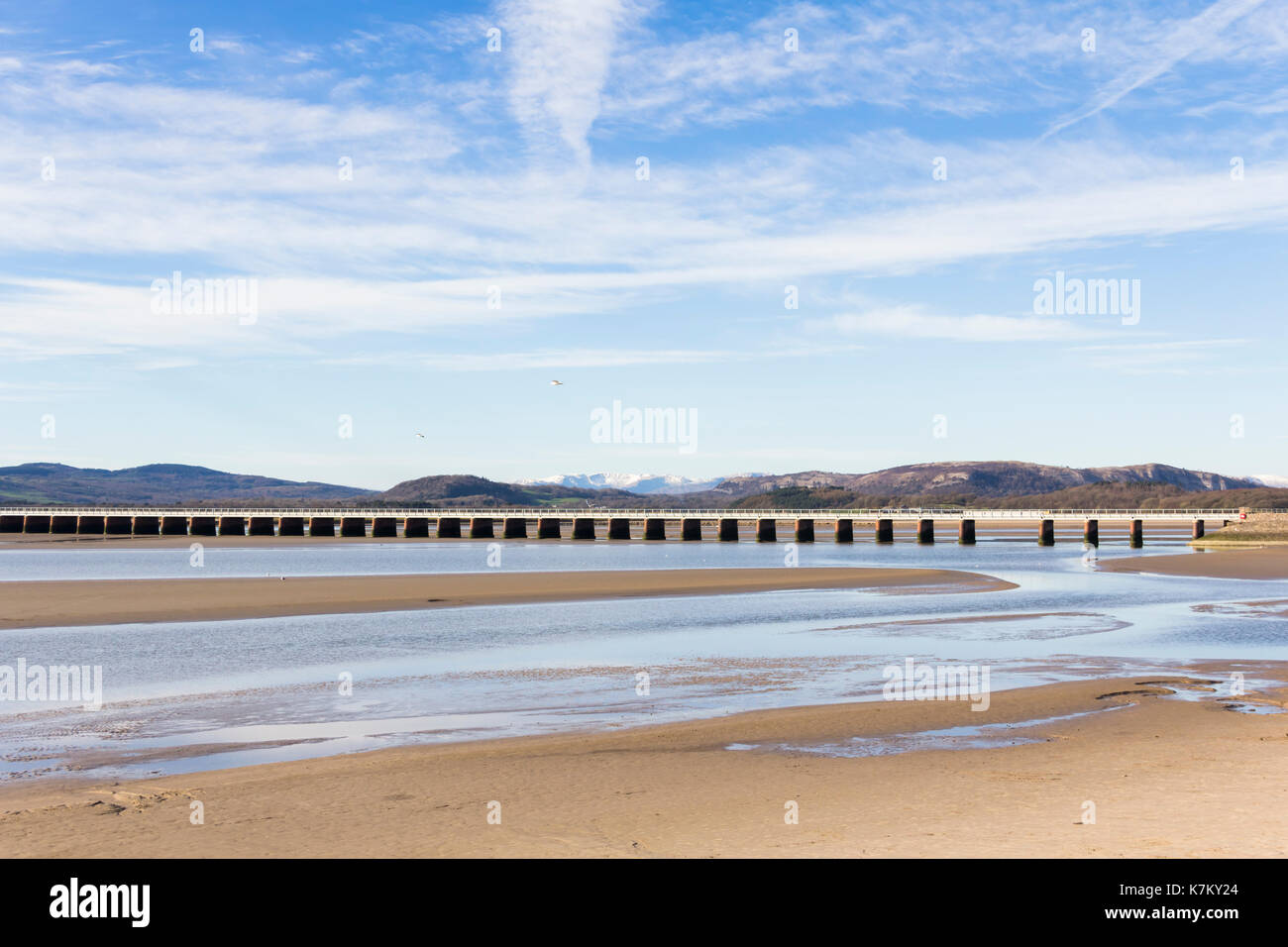 River Kent estuary at low tide and the Arnside railway viaduct which ...