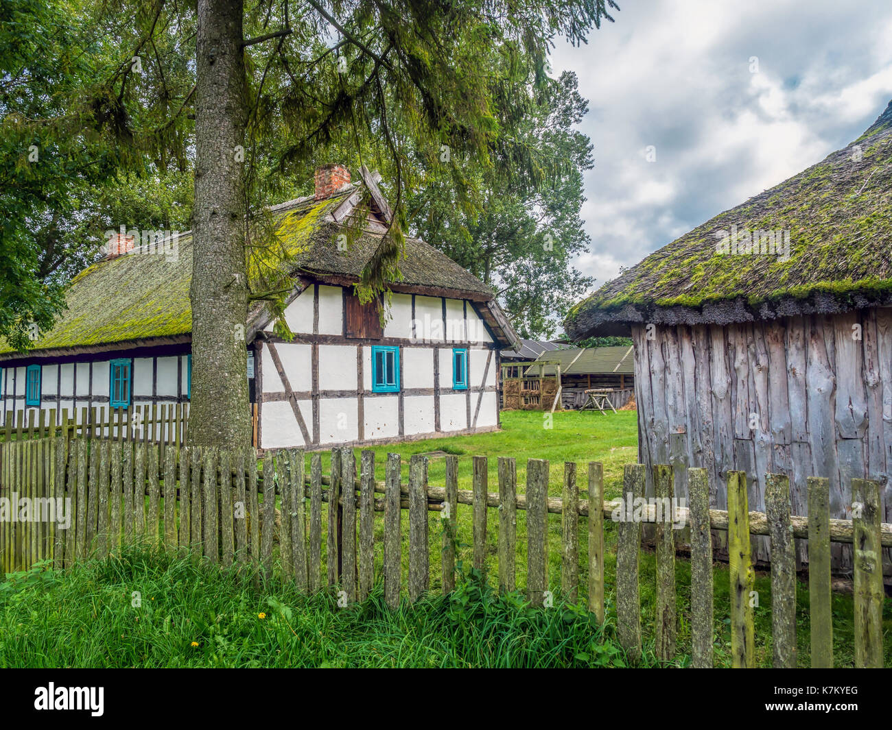 Old wooden farmstead with typical timber framing, part of heritage park ...