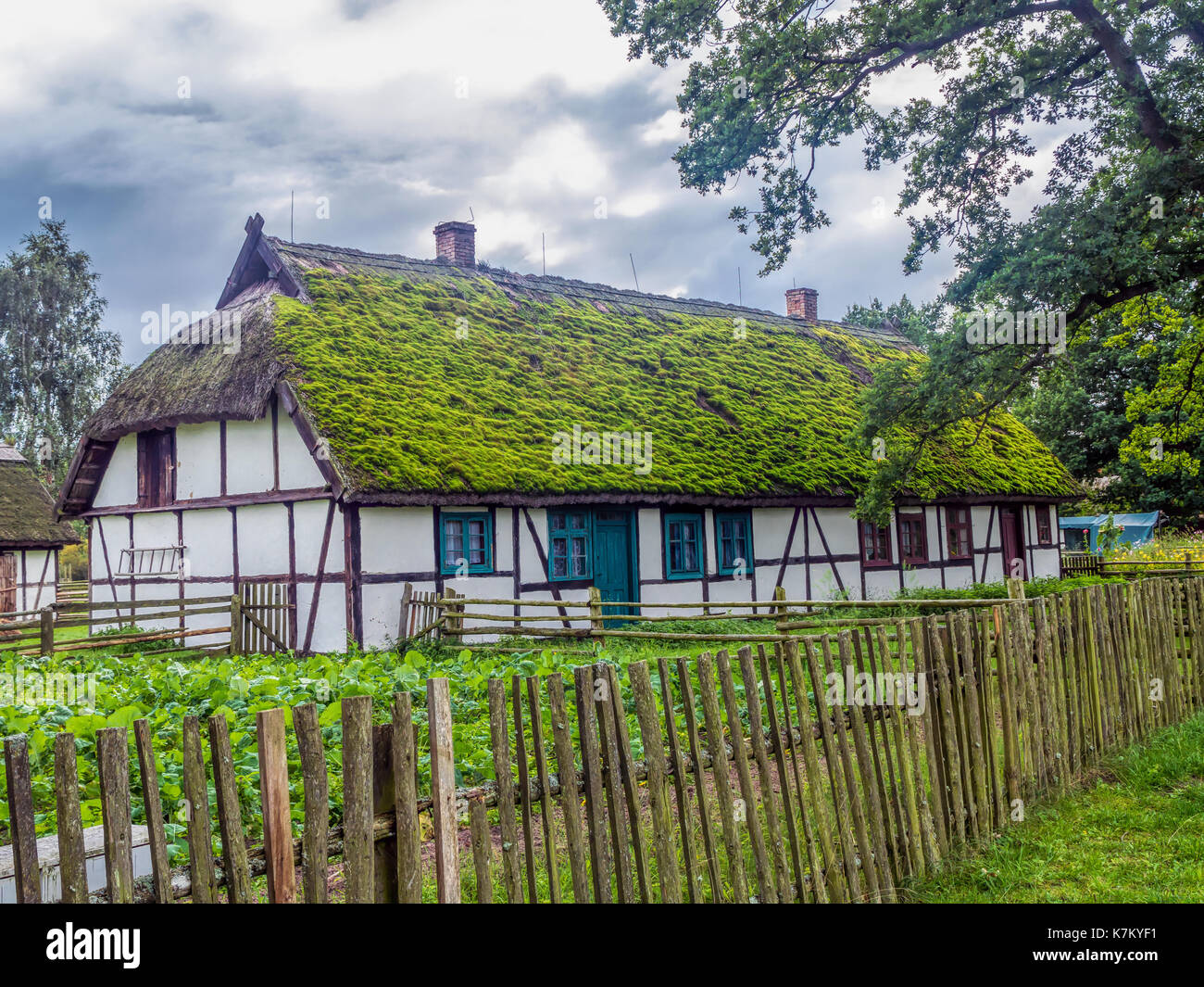 Old wooden farmstead with typical timber framing, part of heritage park ...