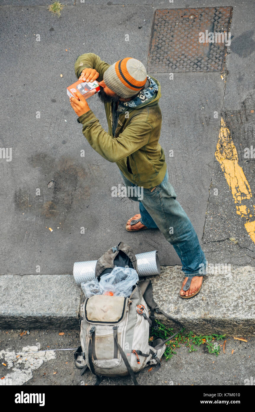 Aerial view of homeless man in Milan, Italy. Italy is suffering during ...