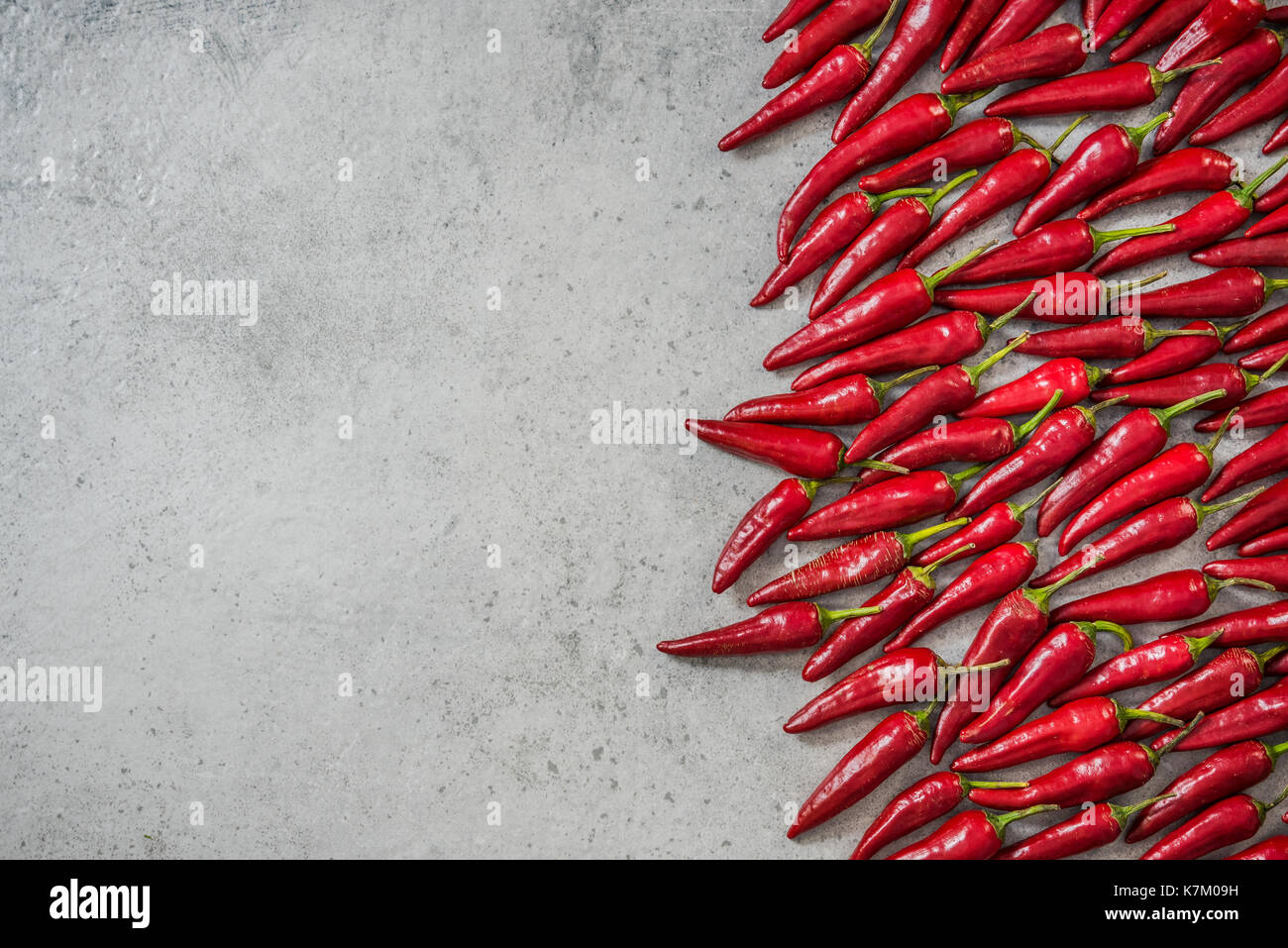 Hot red chili peppers border background Stock Photo - Alamy