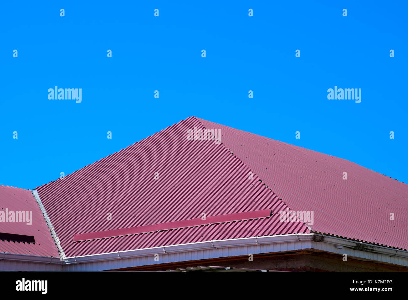 The roof of corrugated sheet. Roofing of metal profile wavy shape Stock ...