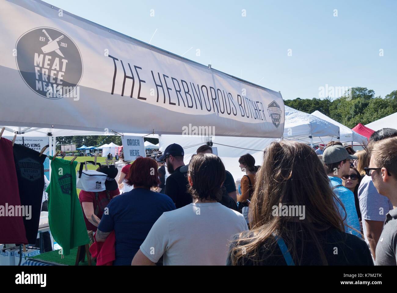A crowd standing in line to try vegan meats by the Herbivorous Butcher ...