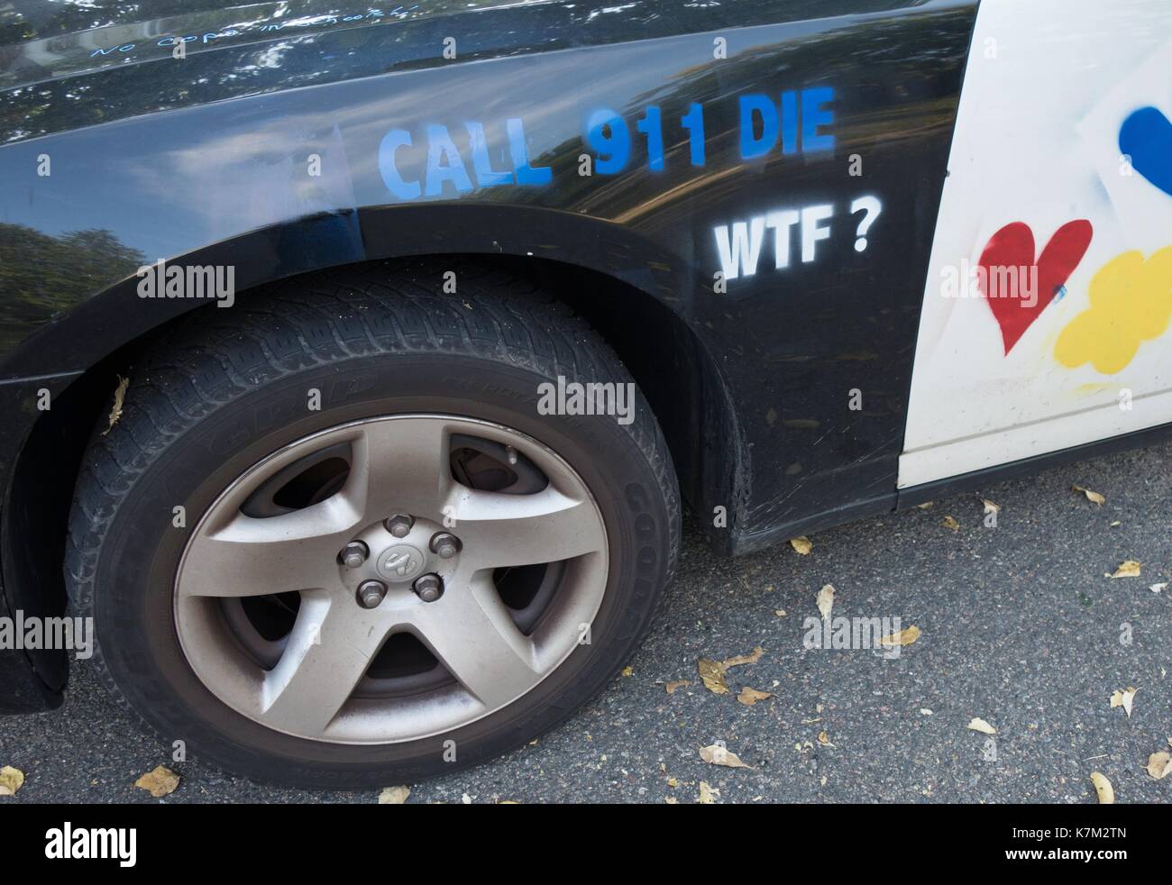 A close up of a car painted with protests against police brutality ...