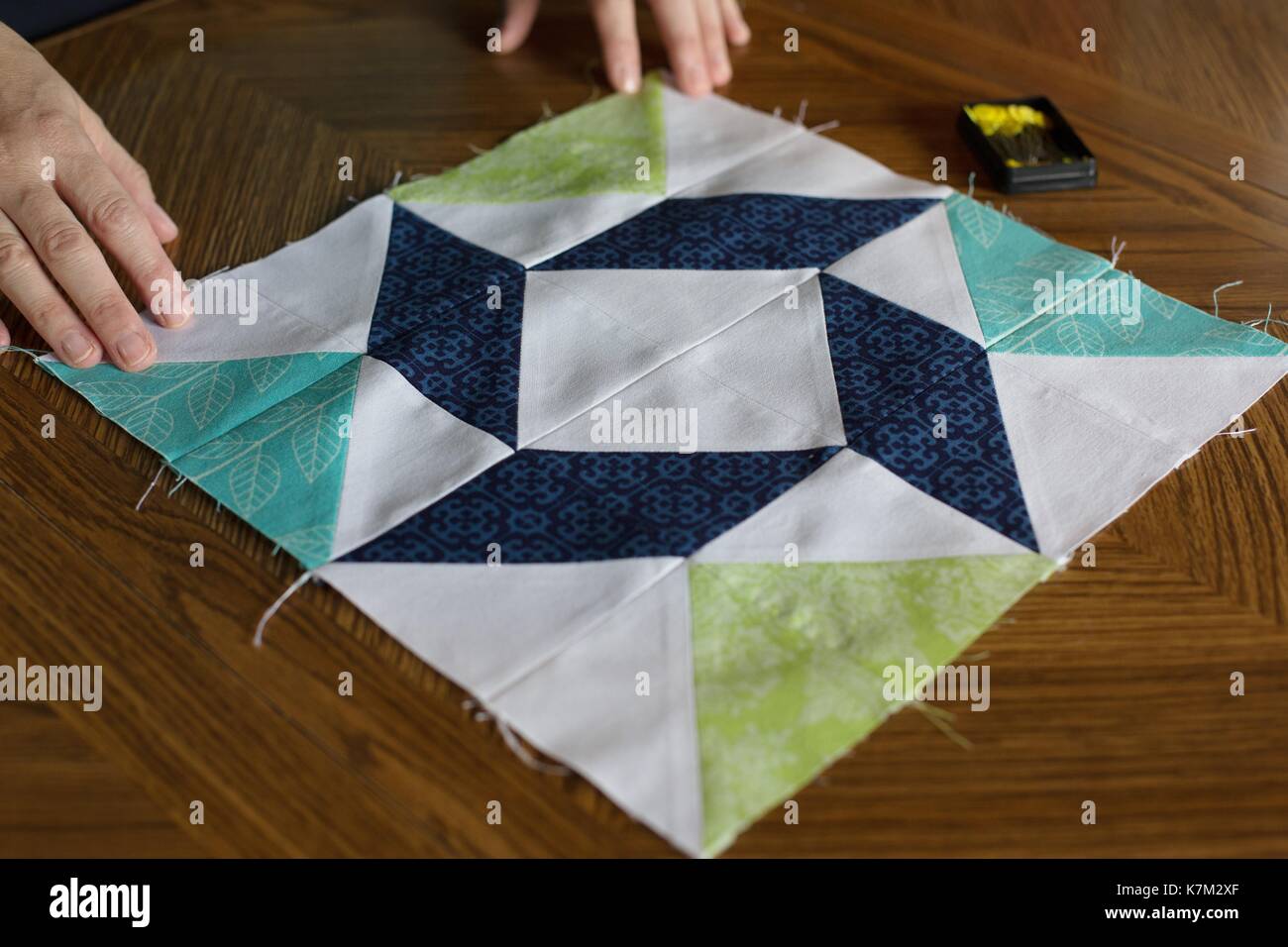 Close up of a person creating a quilt block Stock Photo - Alamy